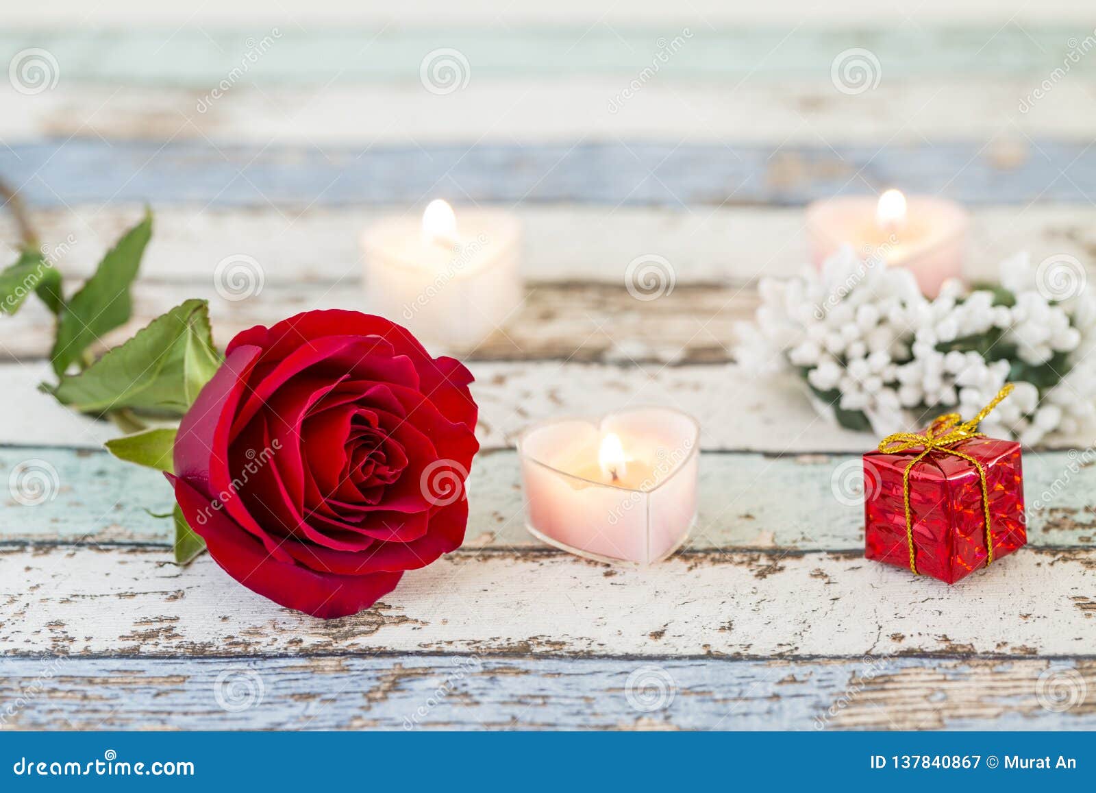 Single Red Rose, Gift Box, Candles, and White Flowers on Turquoise ...