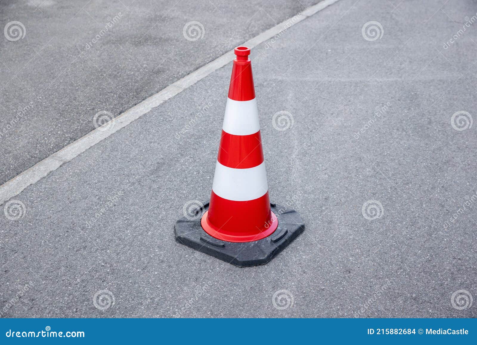 Single Red and White Striped Warning Cone on Gray Asphalt, by Day ...
