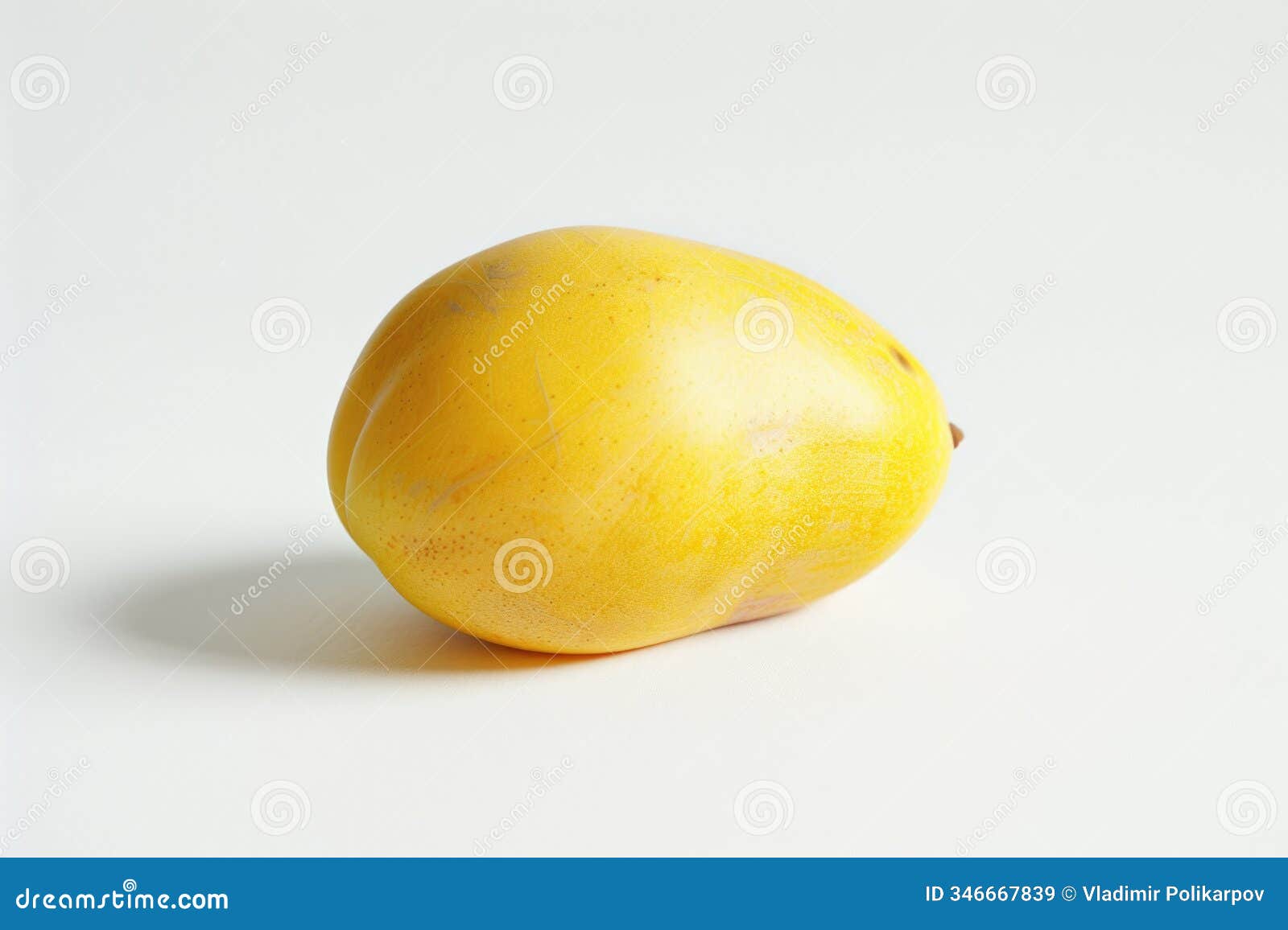 A Single Ripe Mango Sits on a White Surface Stock Image - Image of ...