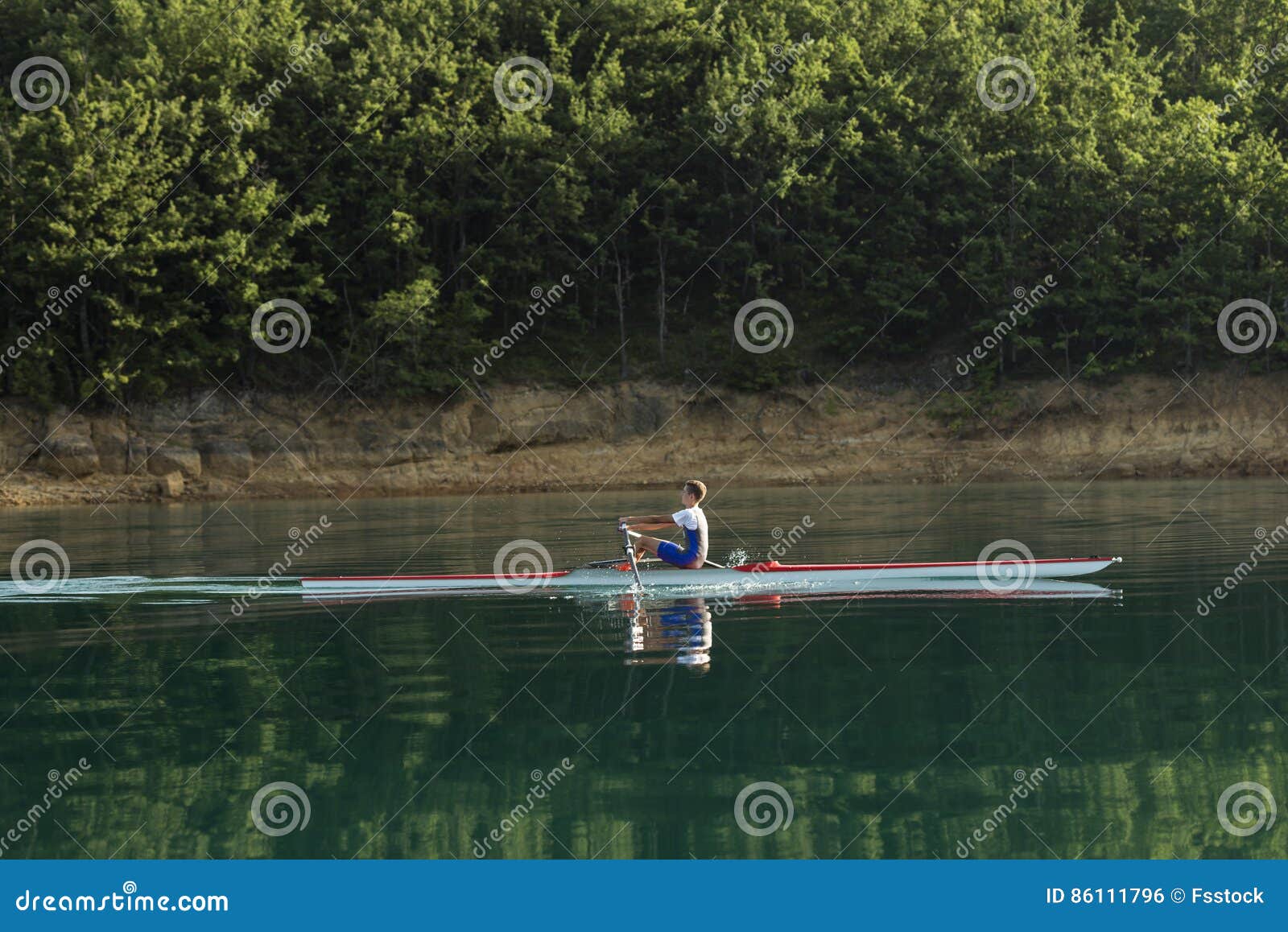Single rower at sunrise stock photo. Image of outdoor - 86111796
