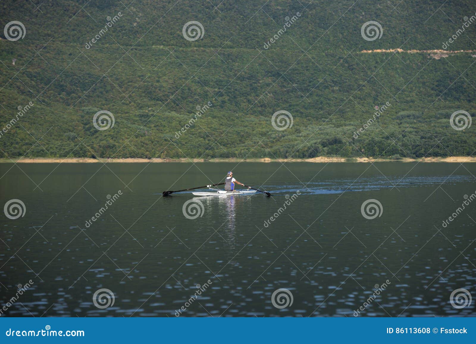 Single rower at sunrise stock photo. Image of oars, rower - 86113608