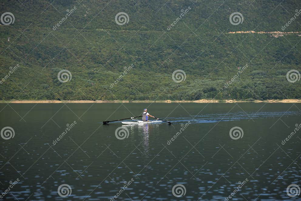 Single rower at sunrise stock photo. Image of oars, rower - 86113608