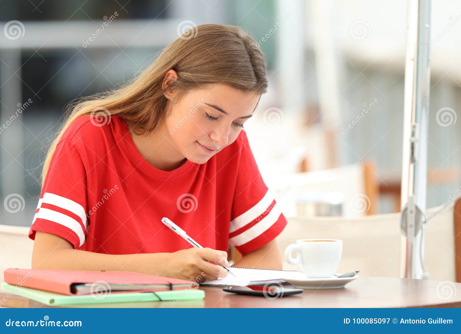 Serious Student Studying Taking Notes in a Bar Stock Image - Image of ...