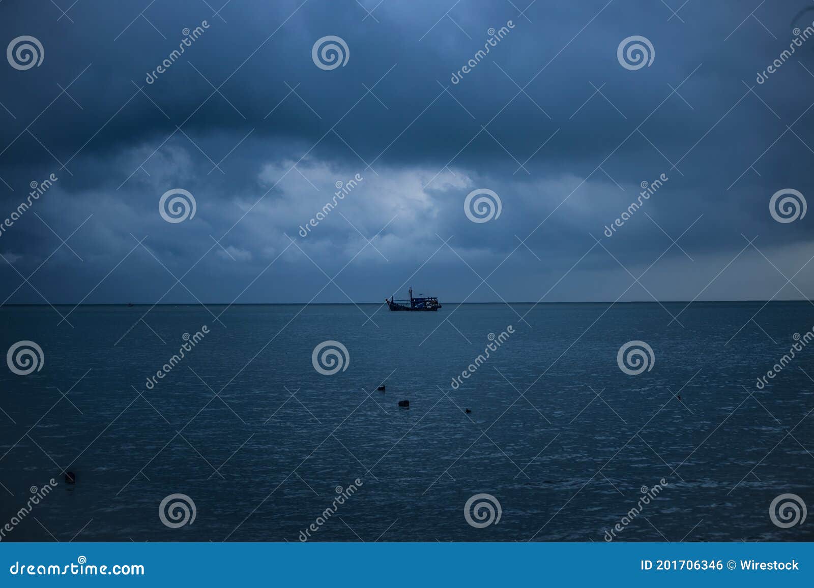 Single Ship on the Calm Sea Under the Clouds in the Evening Stock Photo ...
