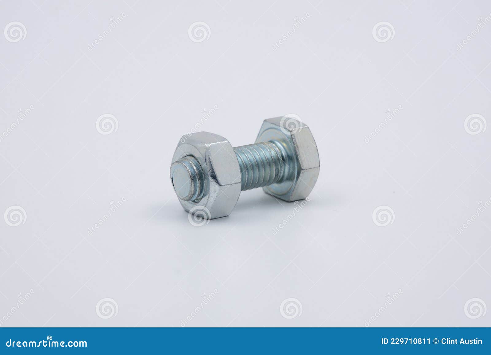 A Single Short Bolt with a Nut Attached Stock Image - Image of ...