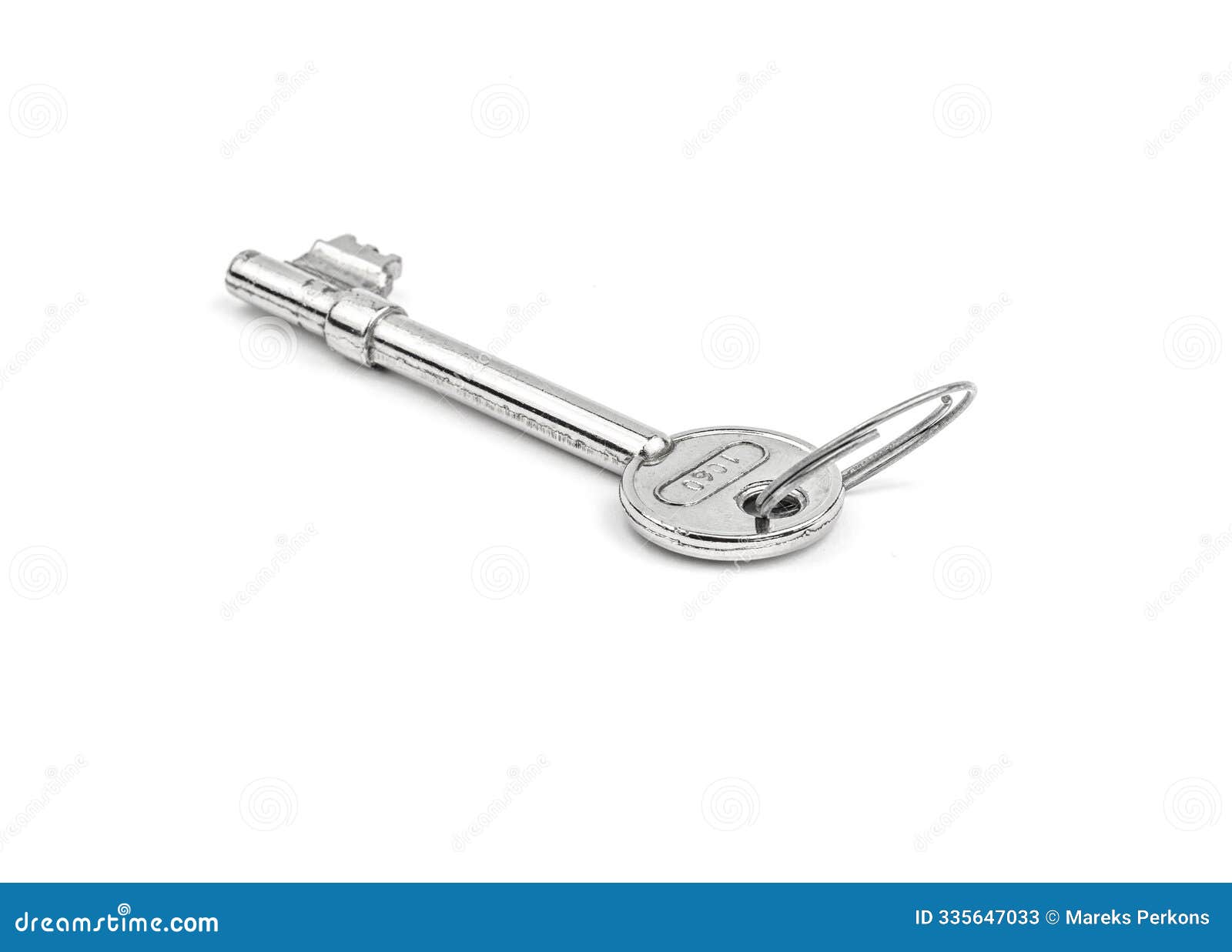 A Single Silver Colored Key with a Round Head and a Key Ring Attached ...
