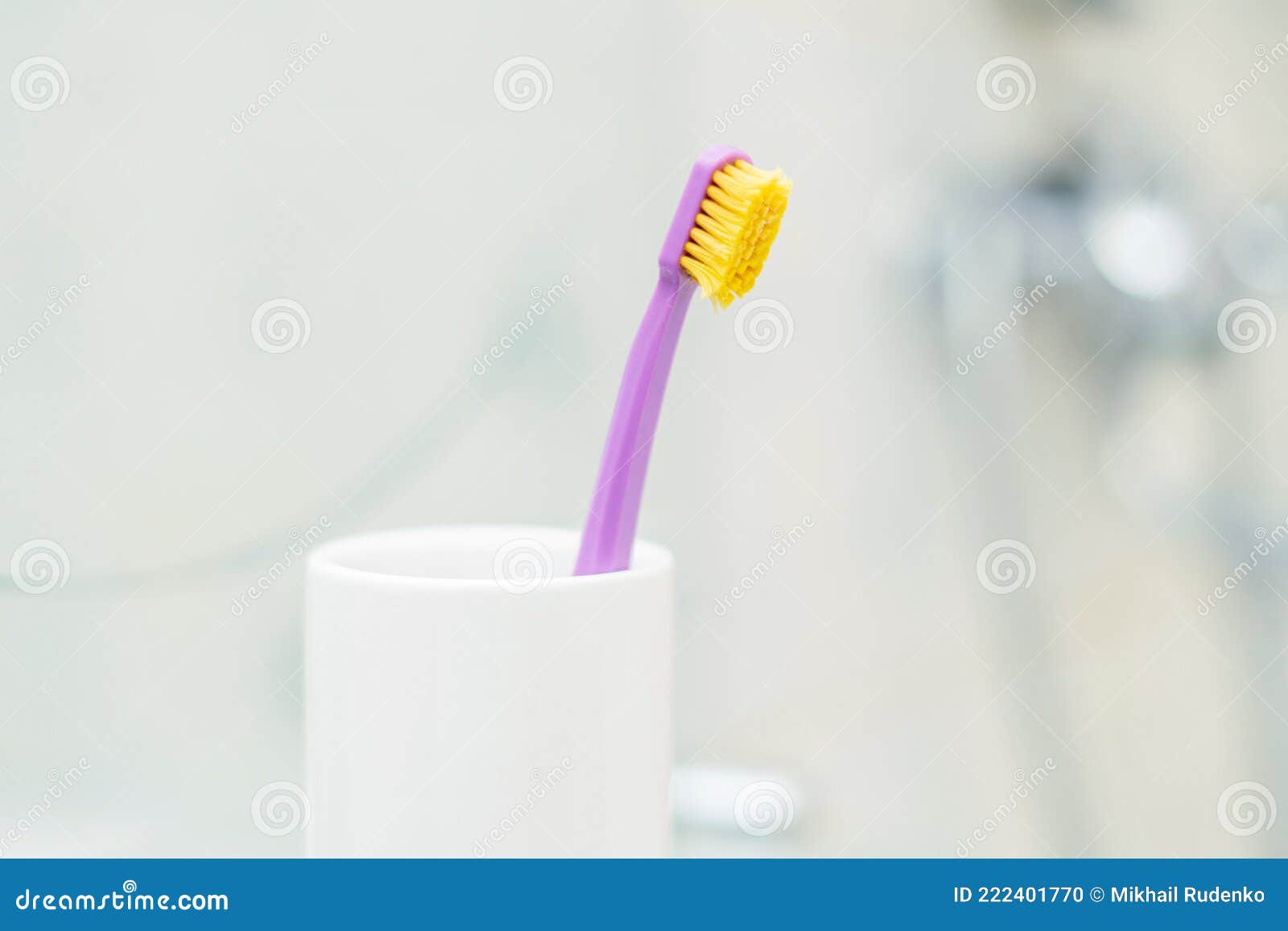 A Single Simple Toothbrush in a Glass in Bathrooms Stock Photo - Image ...