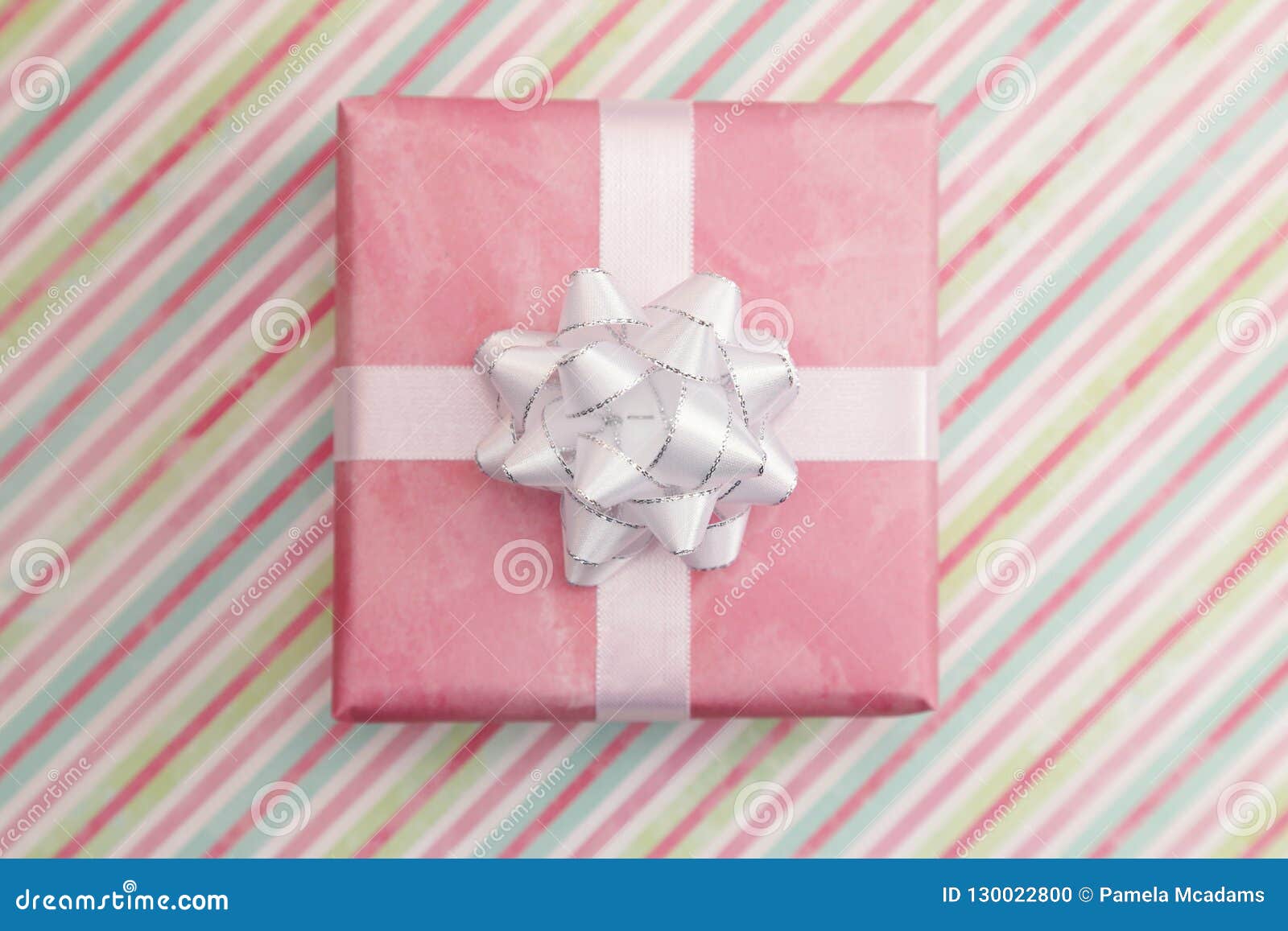Single Simple Wrapped Present on a Matching Background Stock Photo ...
