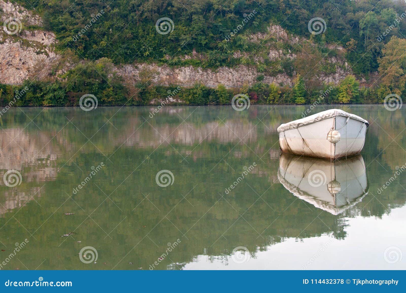 A Rusty Boat Sitting in the Water Stock Photo - Image of rusty, blue ...