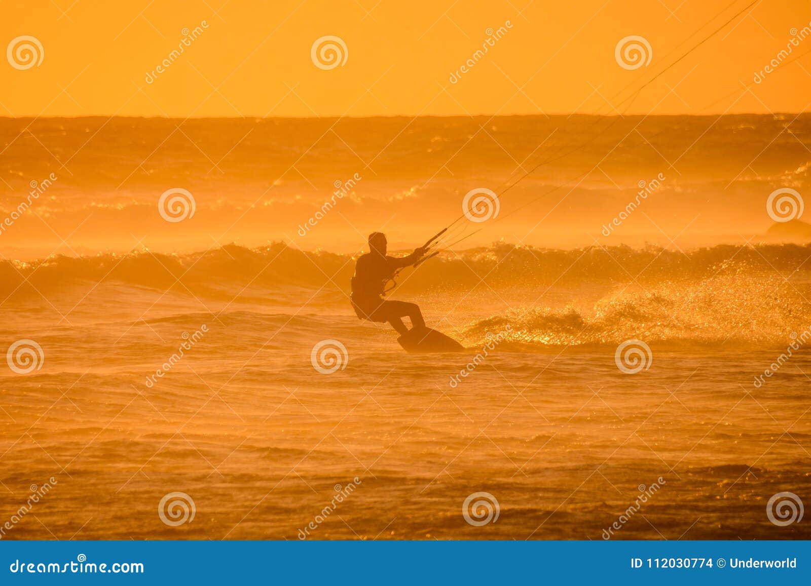 Surfer at Sunset on a Calm Ocean Stock Photo - Image of backlight ...