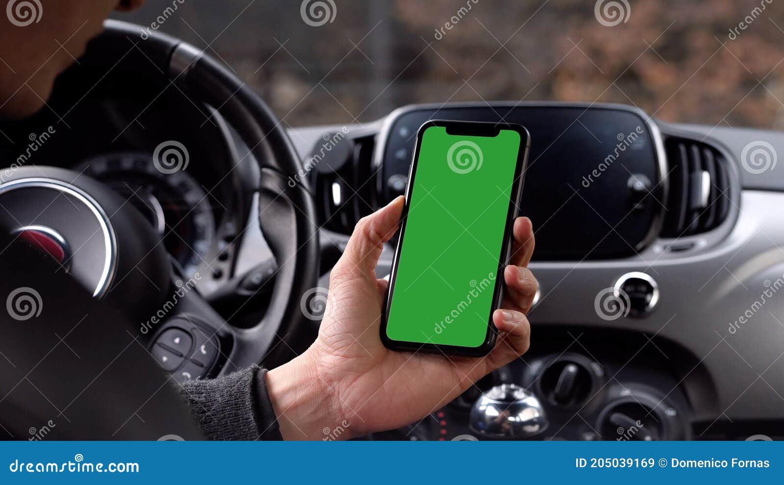 Single Tapping and Holding a Green Screen Smartphone in a Car Stock ...