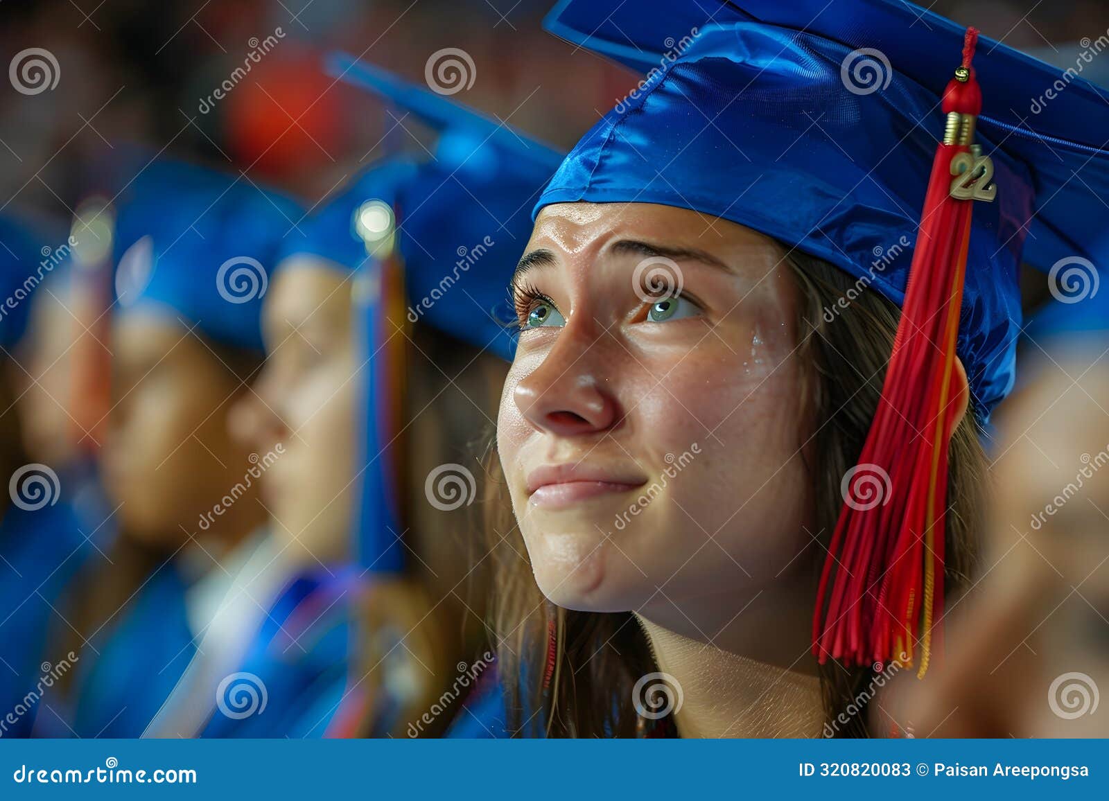 A Single Tear Rolls Down a Students Cheek As they Graduate High School ...