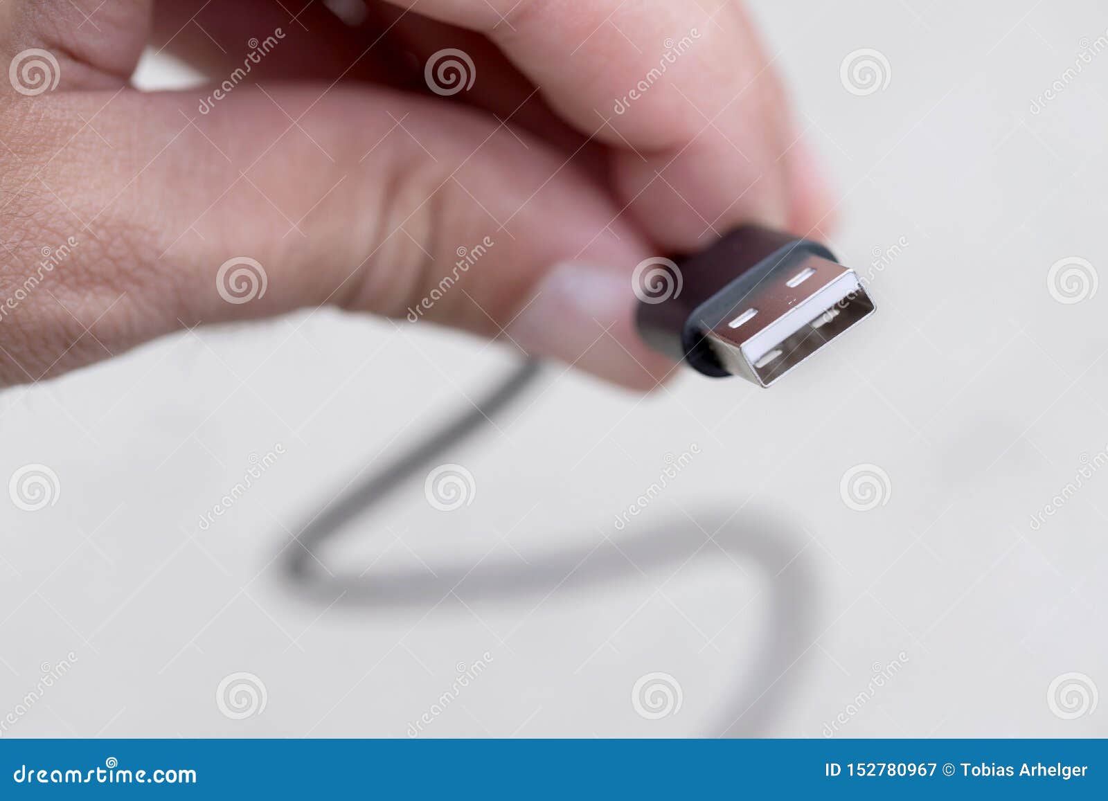 Single usb cable in hand stock image. Image of universal - 152780967