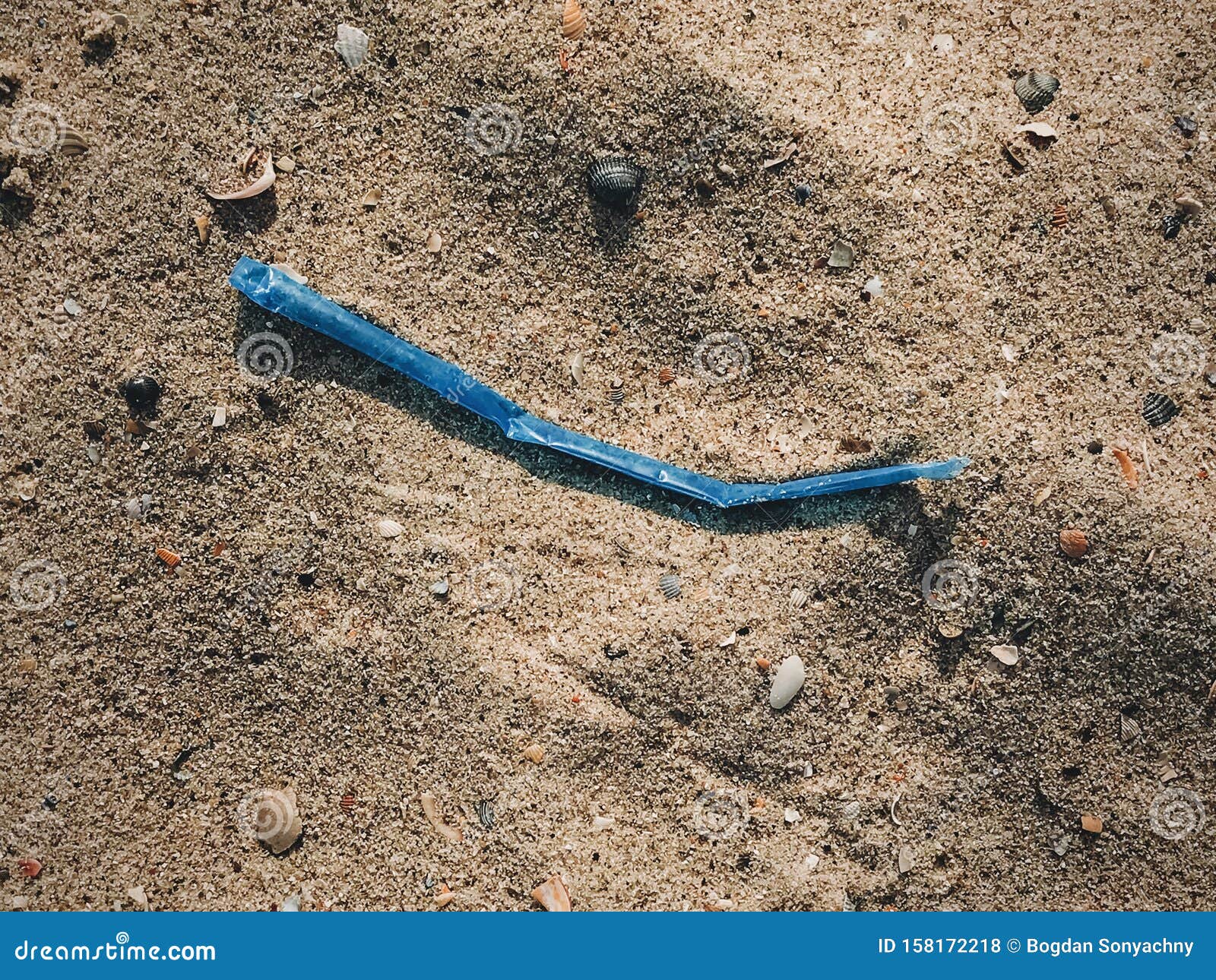 Single Use Plastic Straw in Sand, Marine Trash on the Beach.Plastic ...