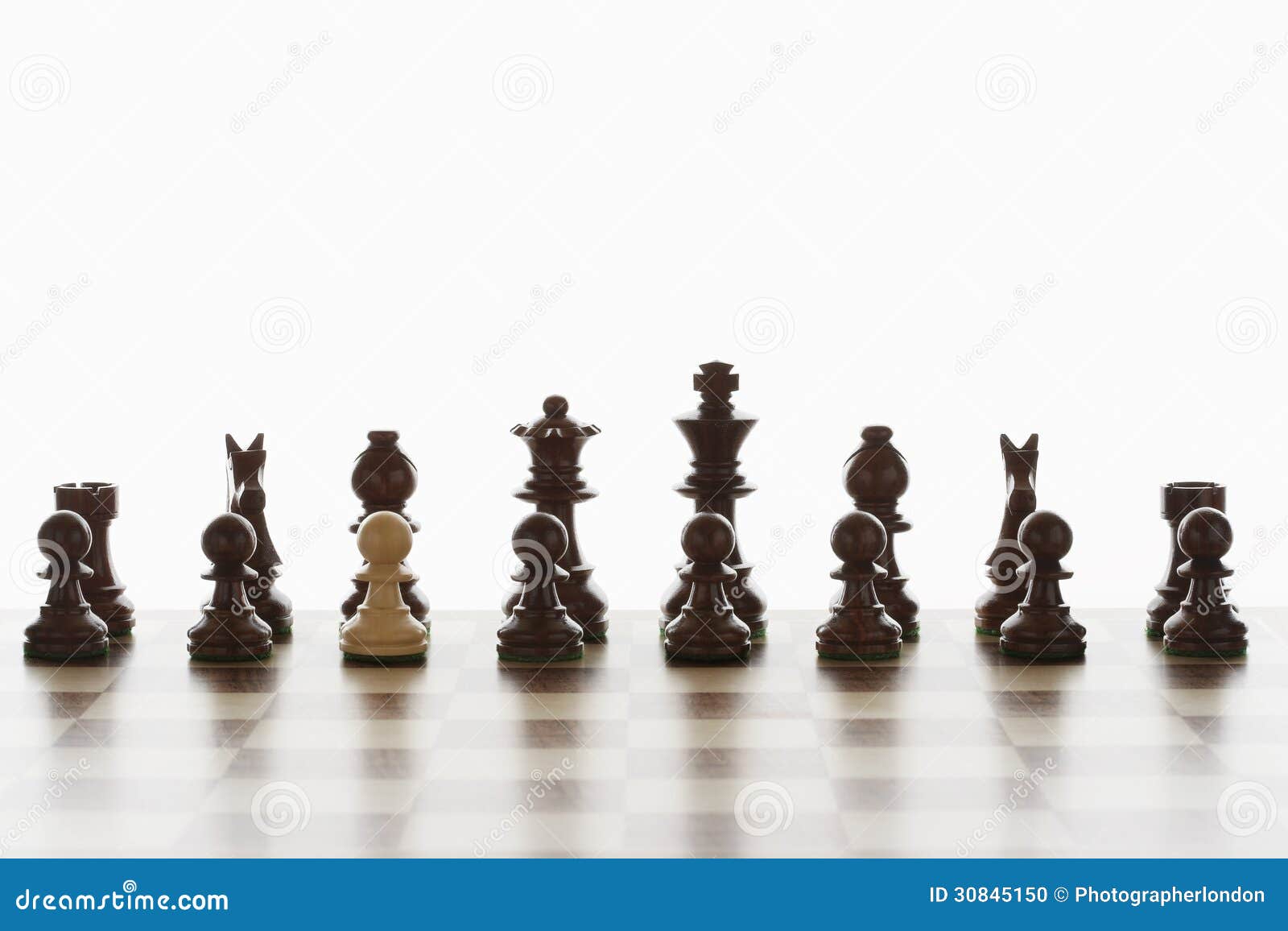 Single White Pawn in Initial Line Up of Black Chess Pieces Stock Photo ...