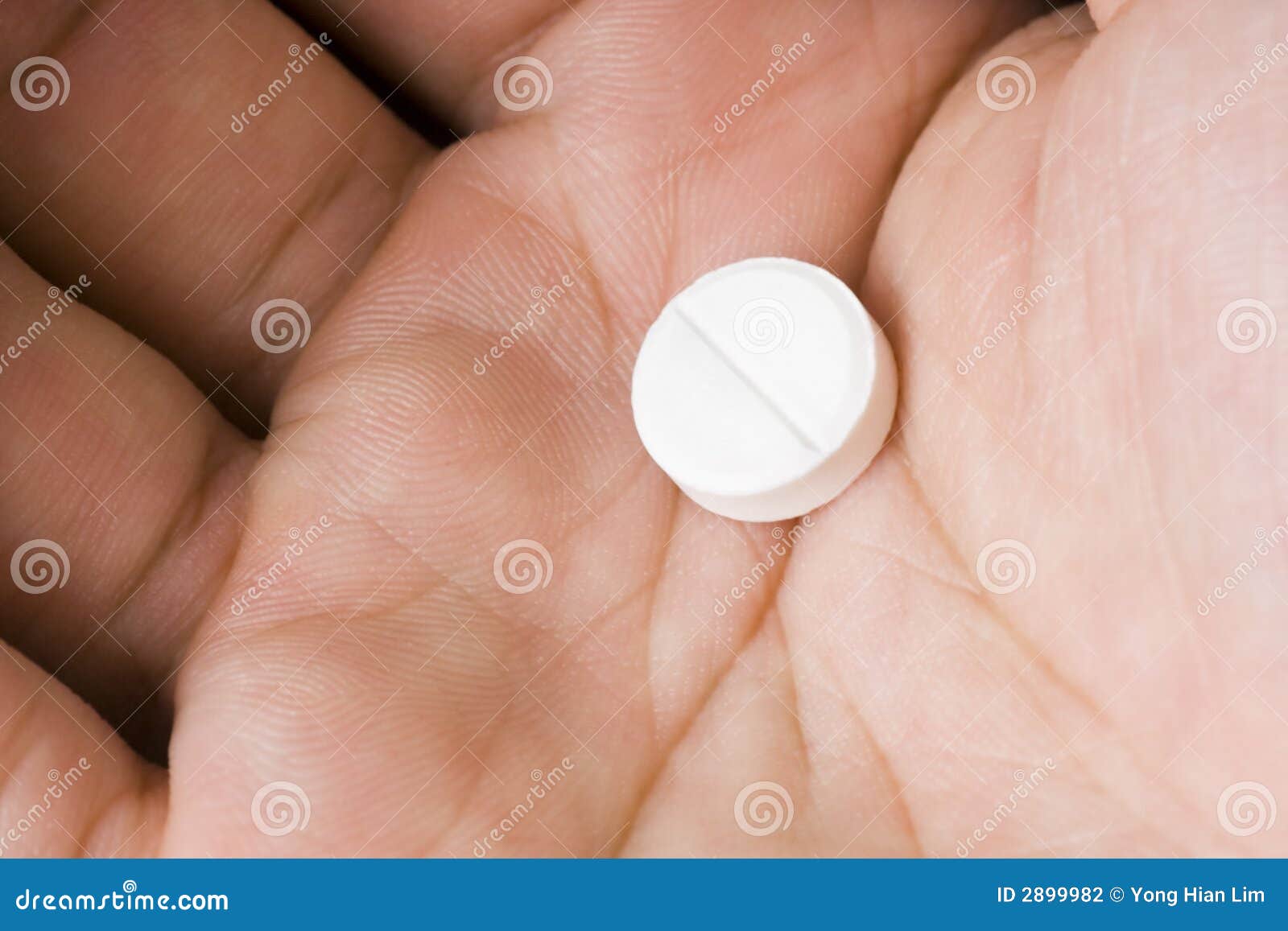 Single white pill in palm stock photo. Image of treatment - 2899982