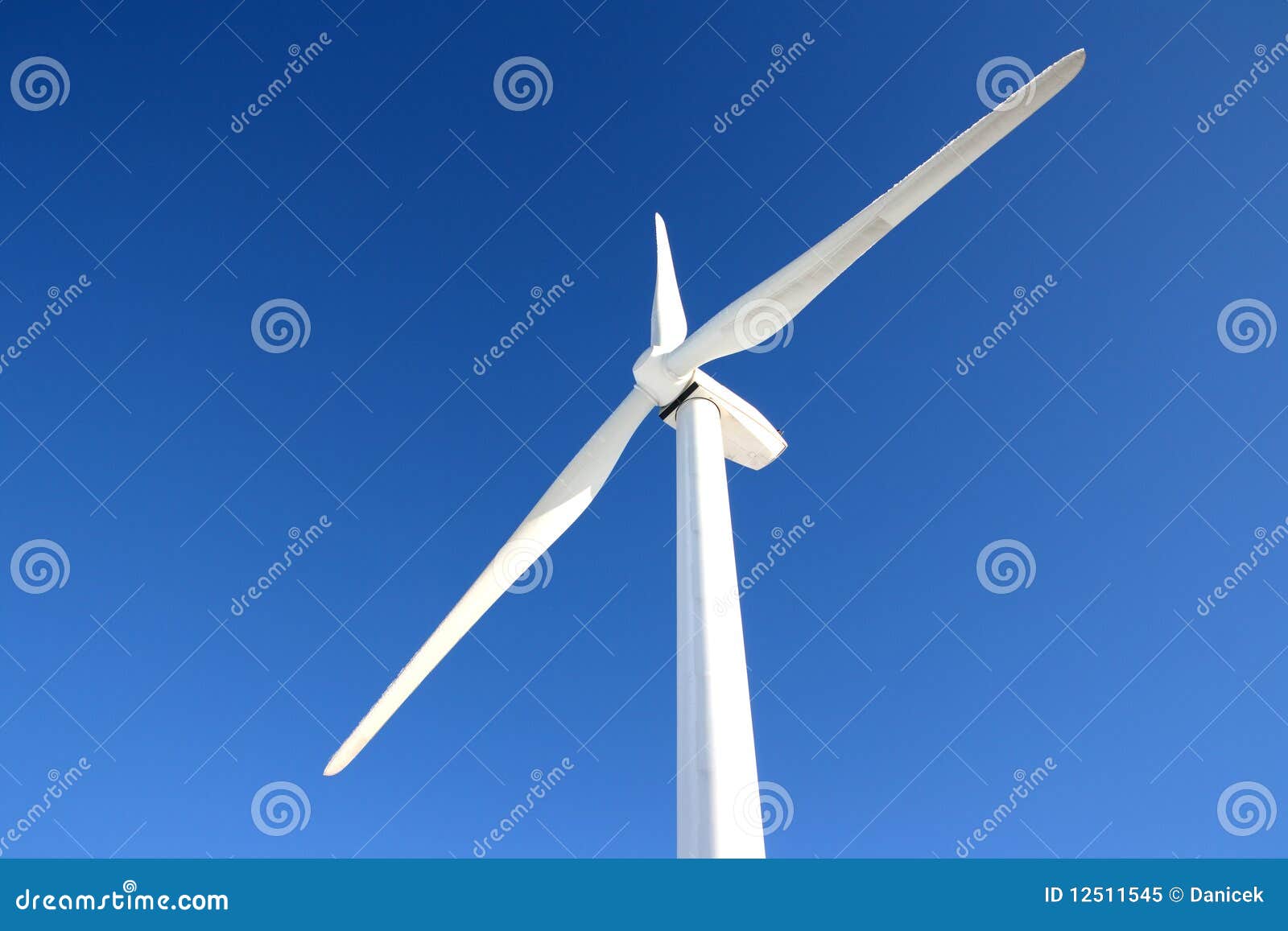 A Single Wind Turbine Towers Over The Ocean, Its Blades Spinning ...