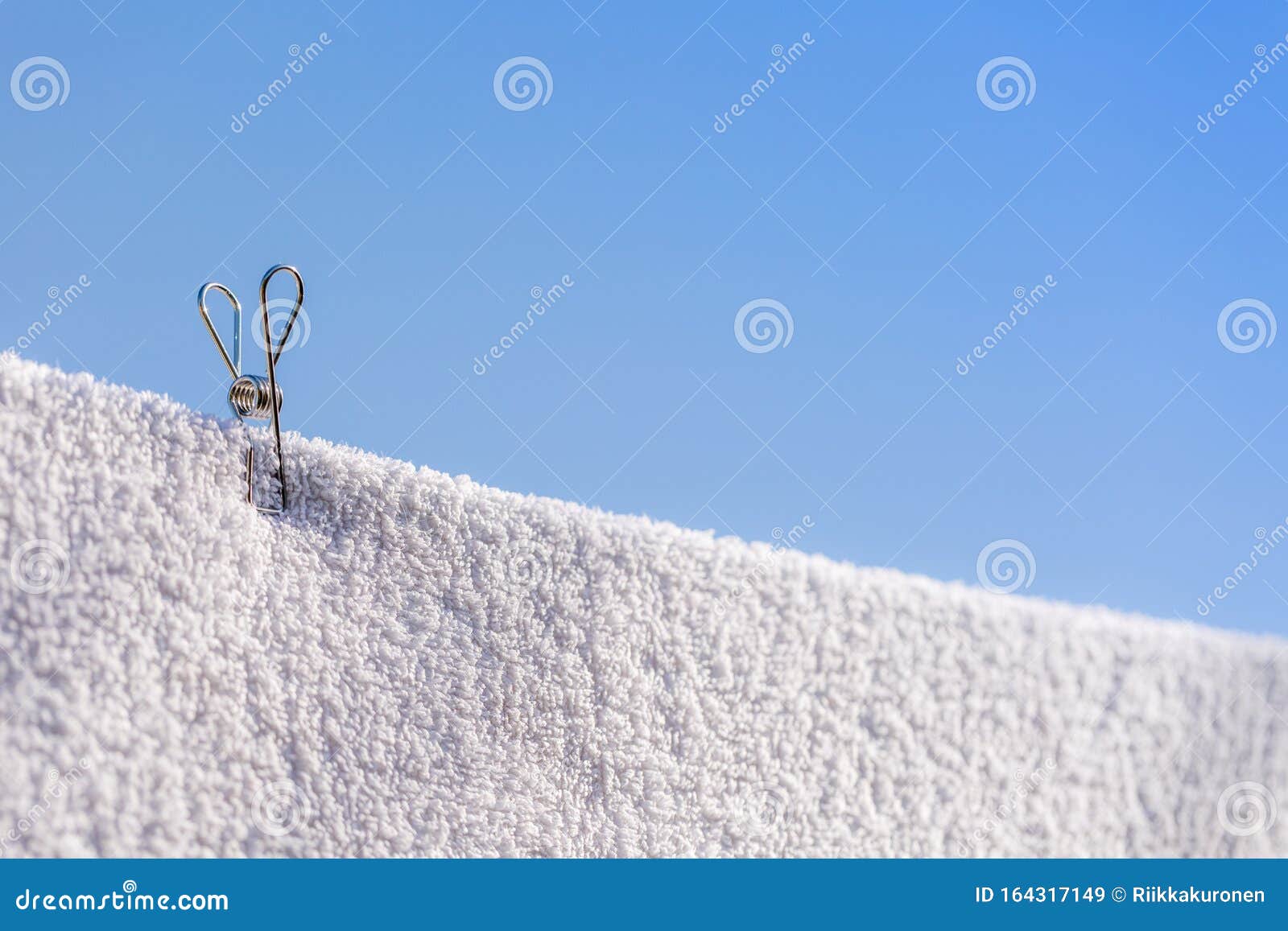 Single Wire Peg on a White Towel on Washing Line Stock Image - Image of ...