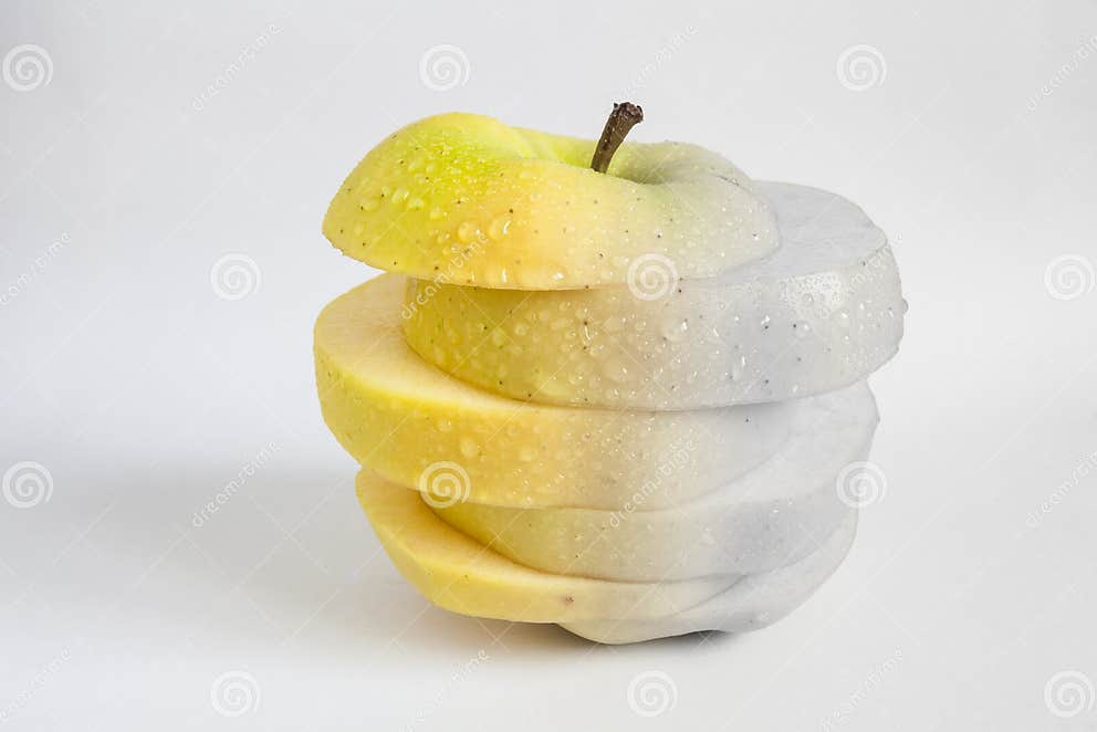 Single Yellow Apple Cut into Horizontal Slices Stock Photo - Image of ...