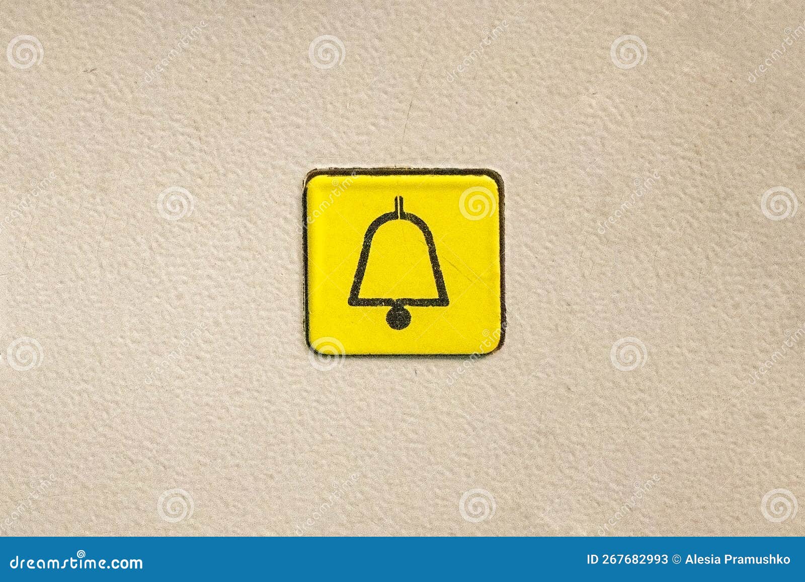 Single Yellow Square Elevator Button with a Bell Icon in a White ...