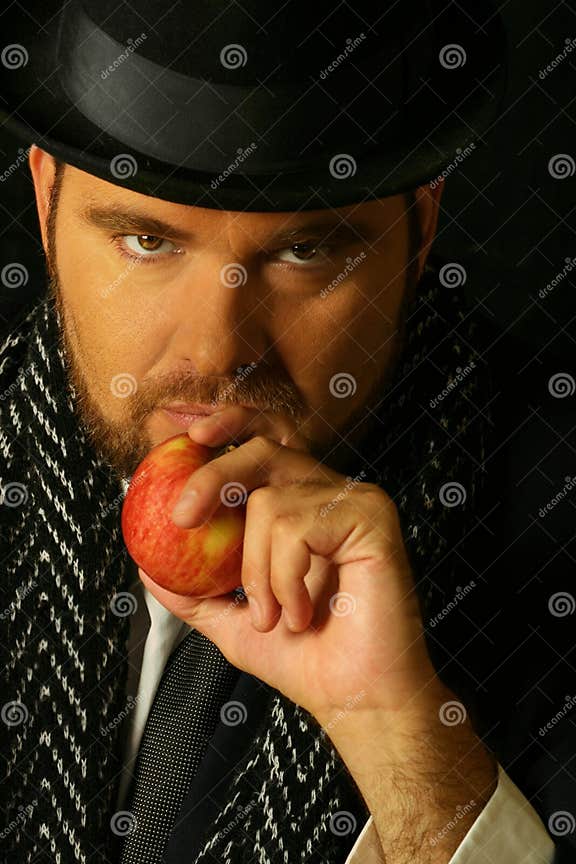 Sinister man with apple stock image. Image of holding - 21768163
