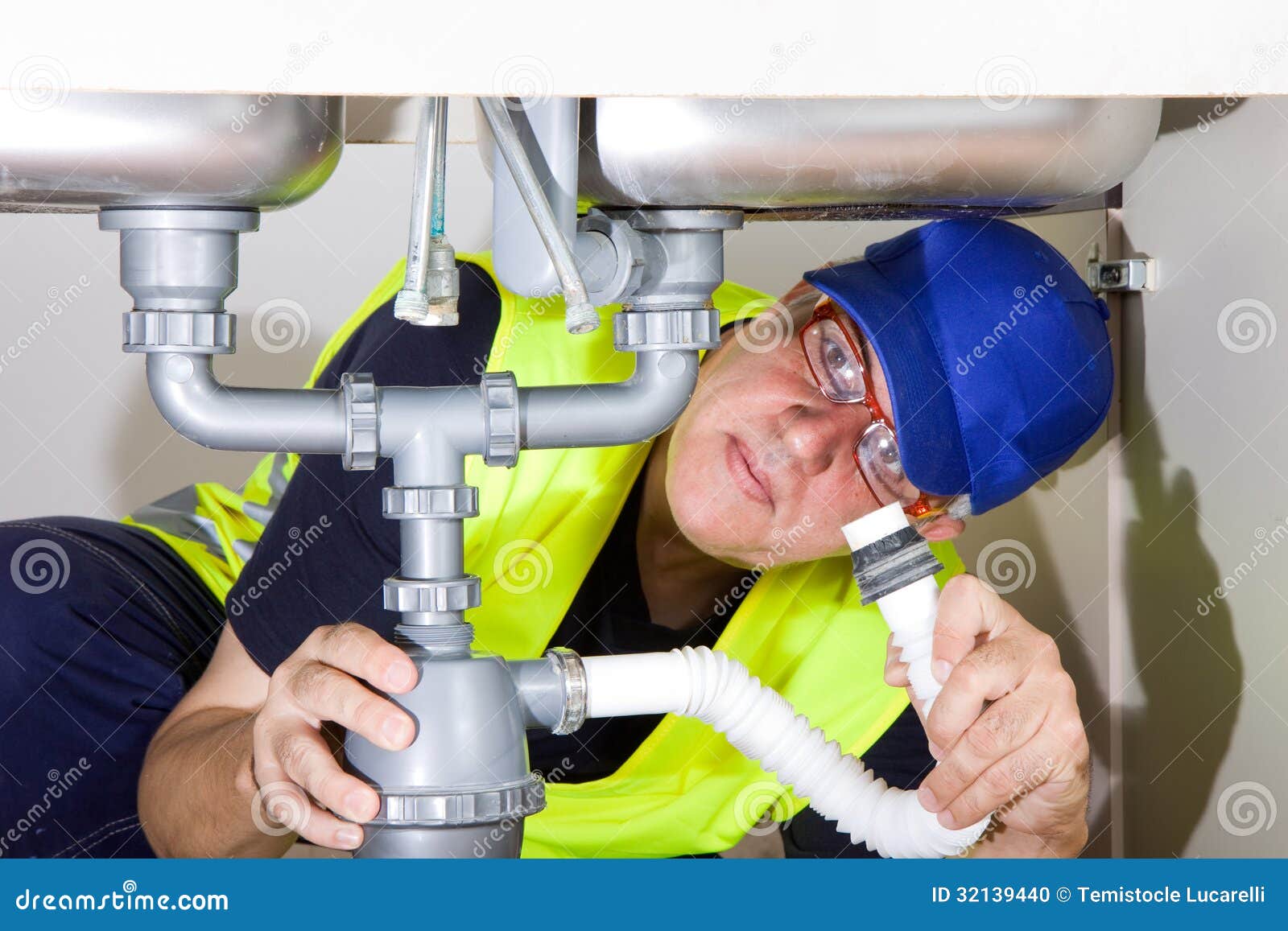 Sink plumber stock photo. Image of handsome, builder - 32139440