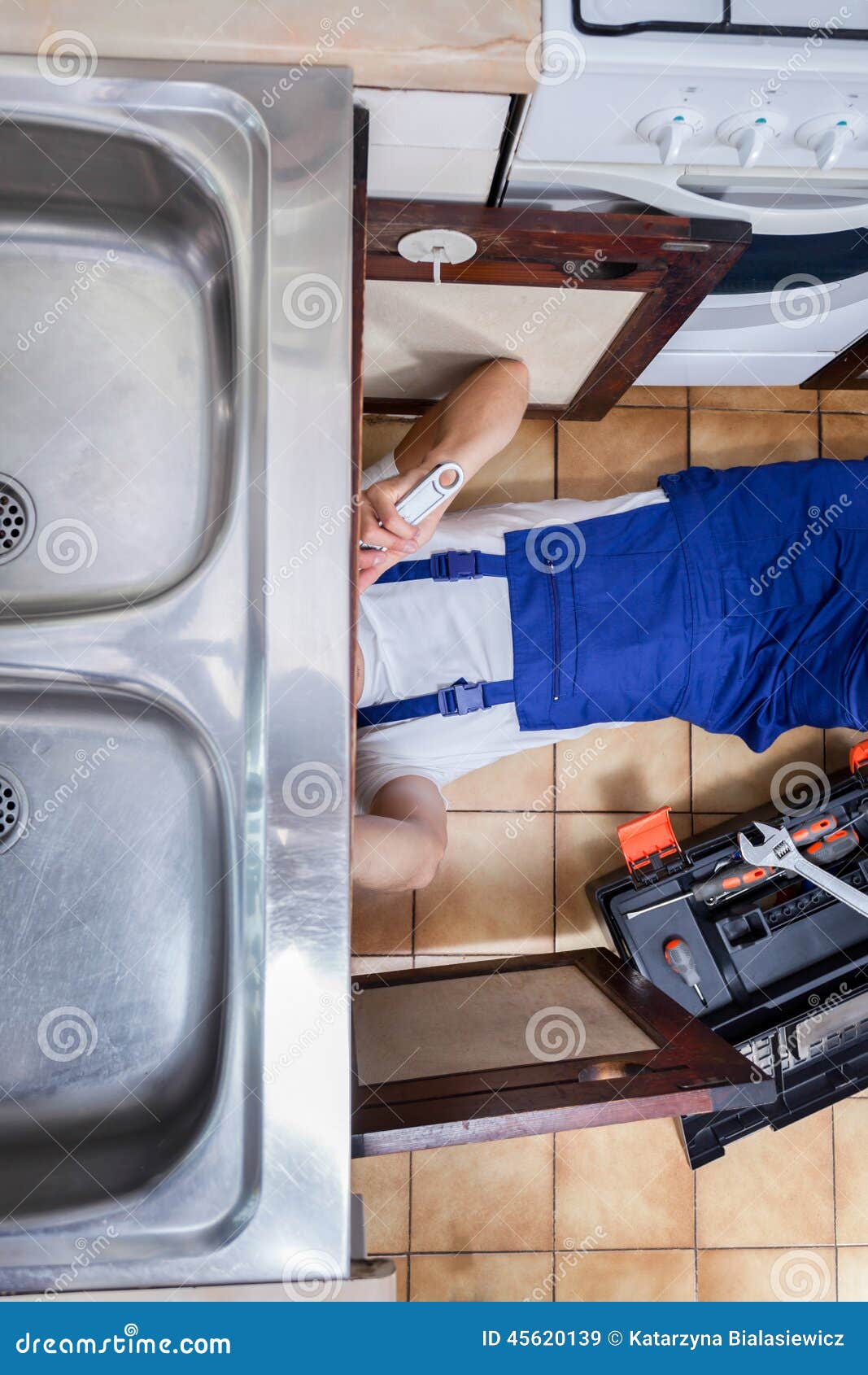 Sink repair in the kitchen stock image. Image of handyman - 45620139