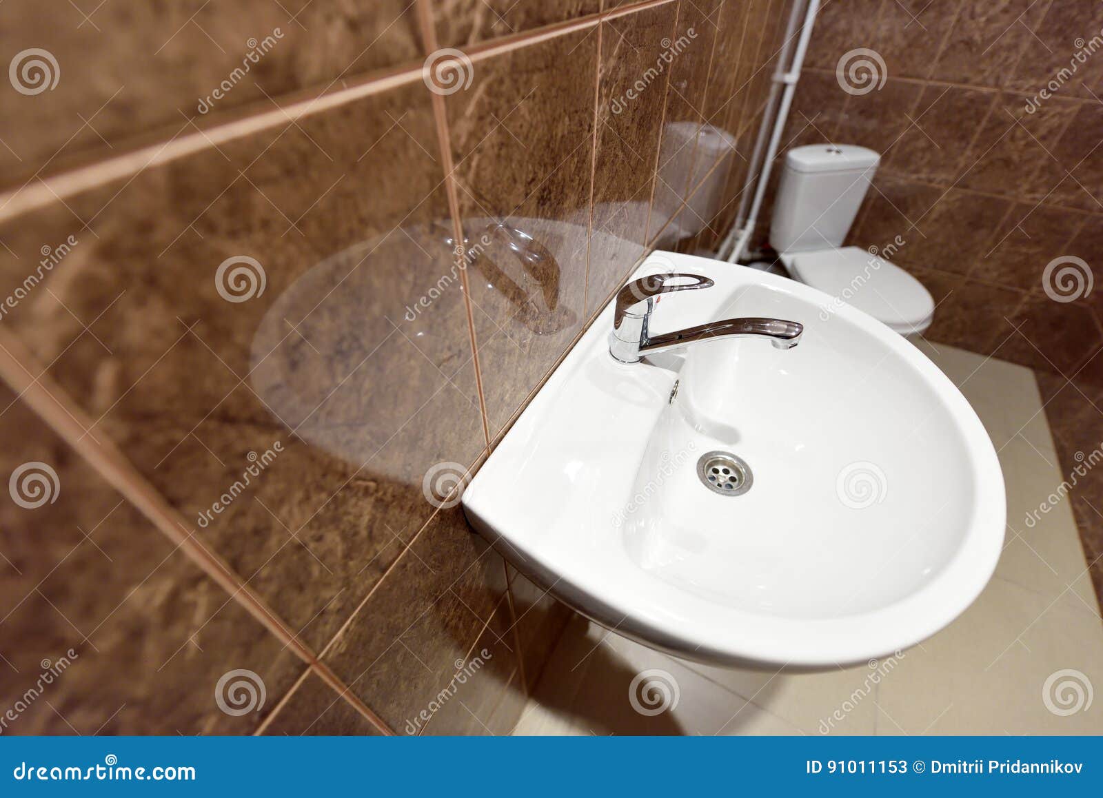 Sink for Washing Hands and Reflection in the Tile Stock Image - Image ...