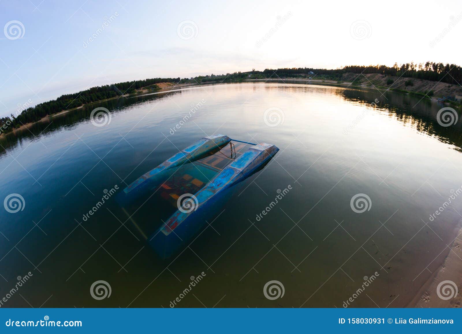 Sinking catamaran in lake stock image. Image of lost - 158030931