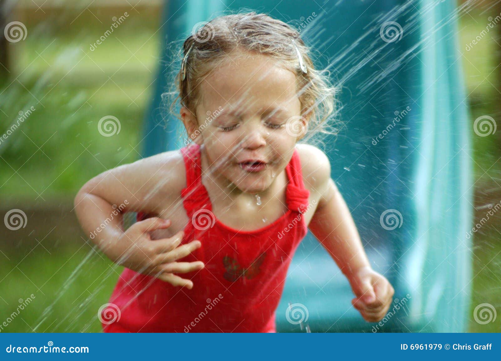 Sipping from a Sprinkler stock image. Image of child, grandchildren ...