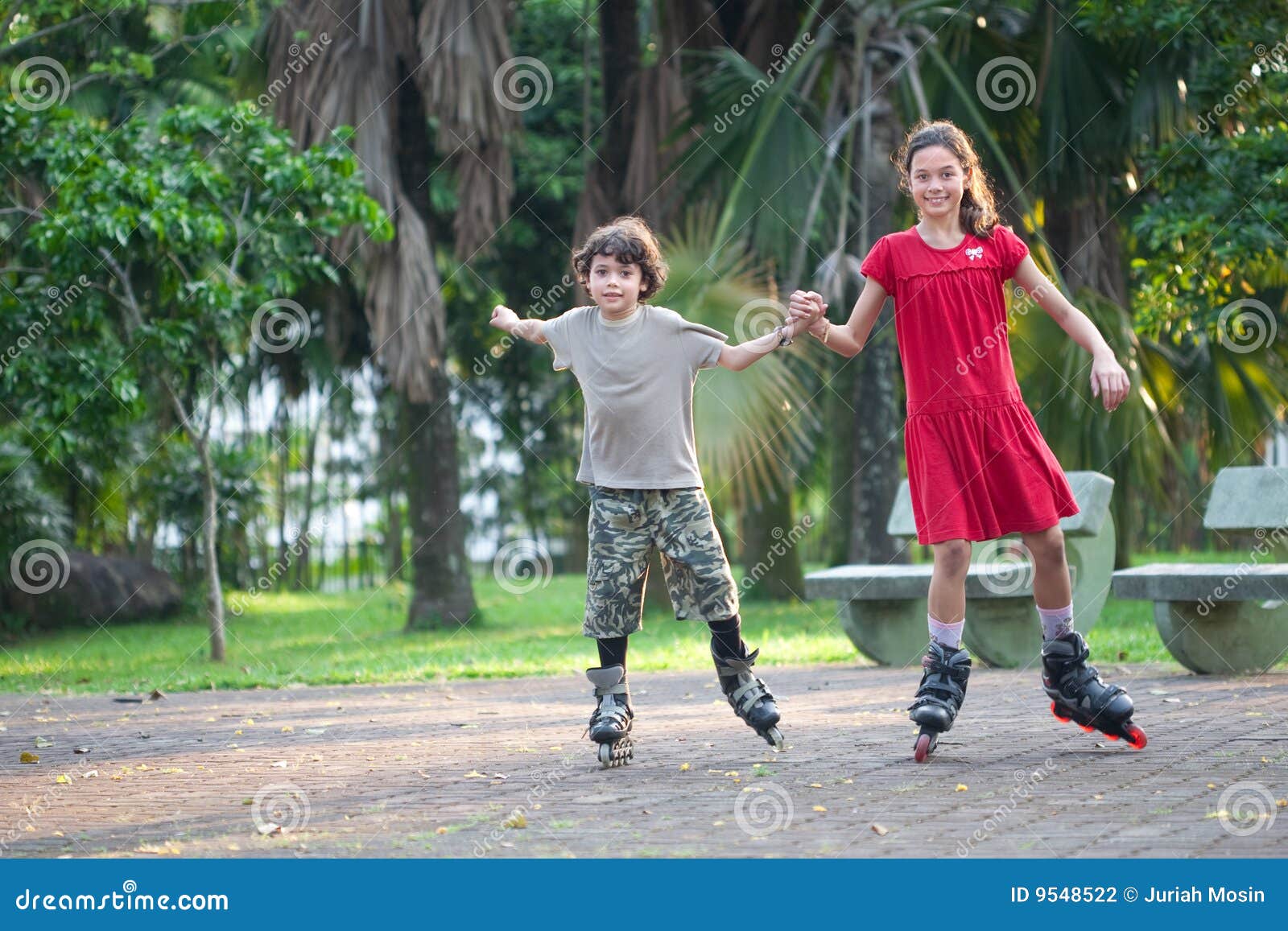 Sister and Brother Having Fun Rollerblading Stock Photo - Image of care ...