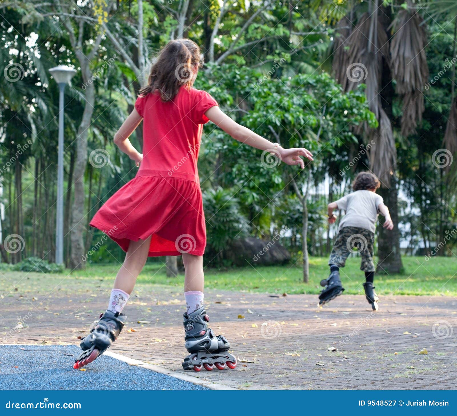 Sister and Brother Having Fun Rollerblading Stock Image - Image of hold ...