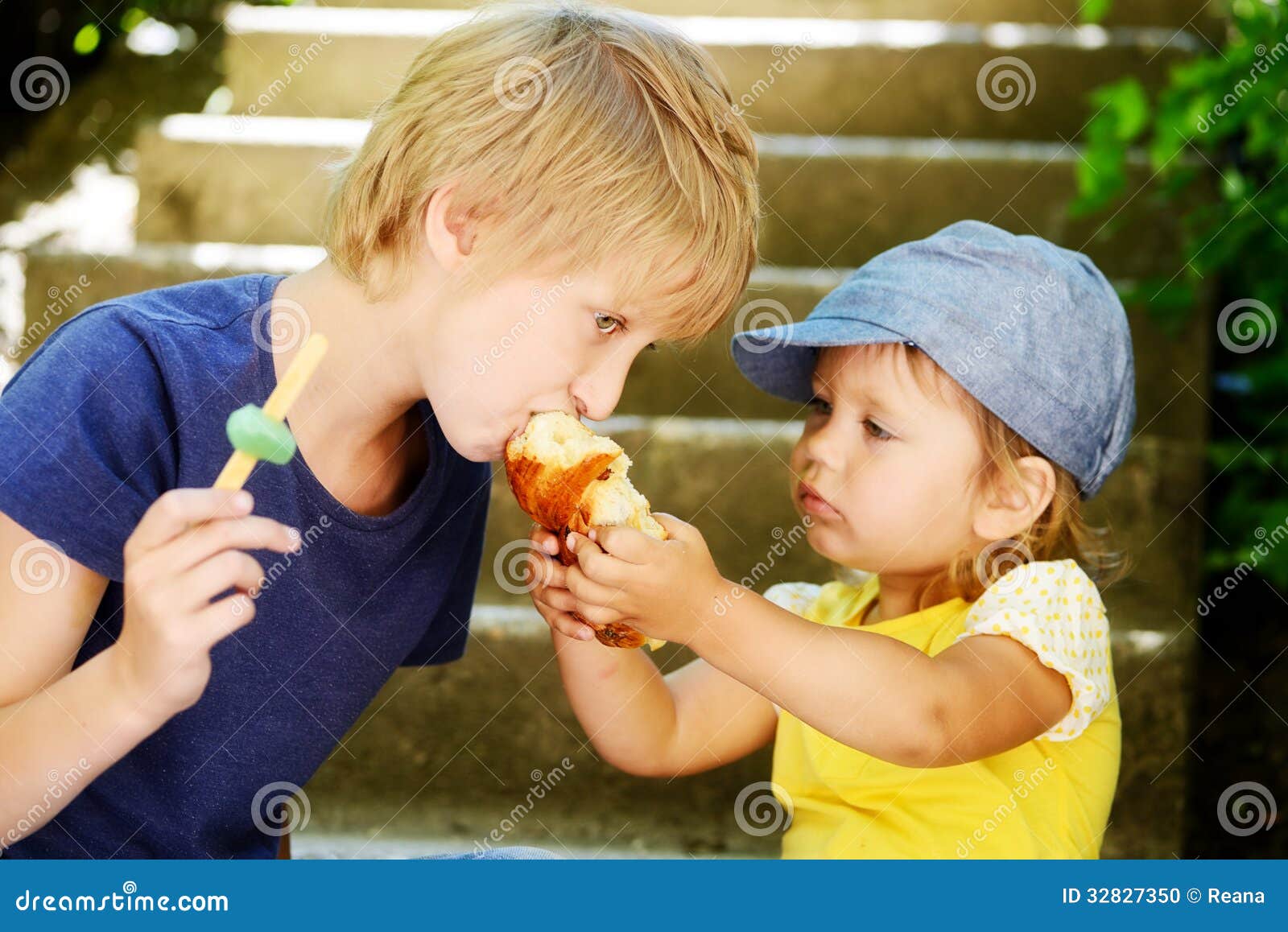 Sister feeding brother stock photo. Image of smile, outside - 32827350