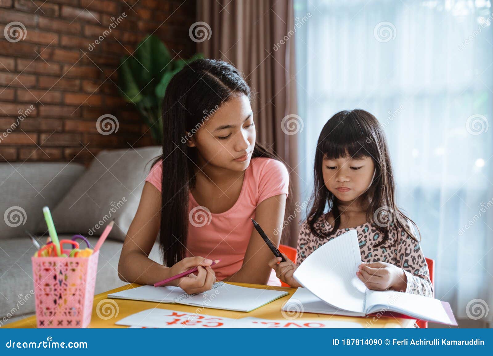 Sister Help Her Little Sibling To Learn and Study Stock Photo - Image ...