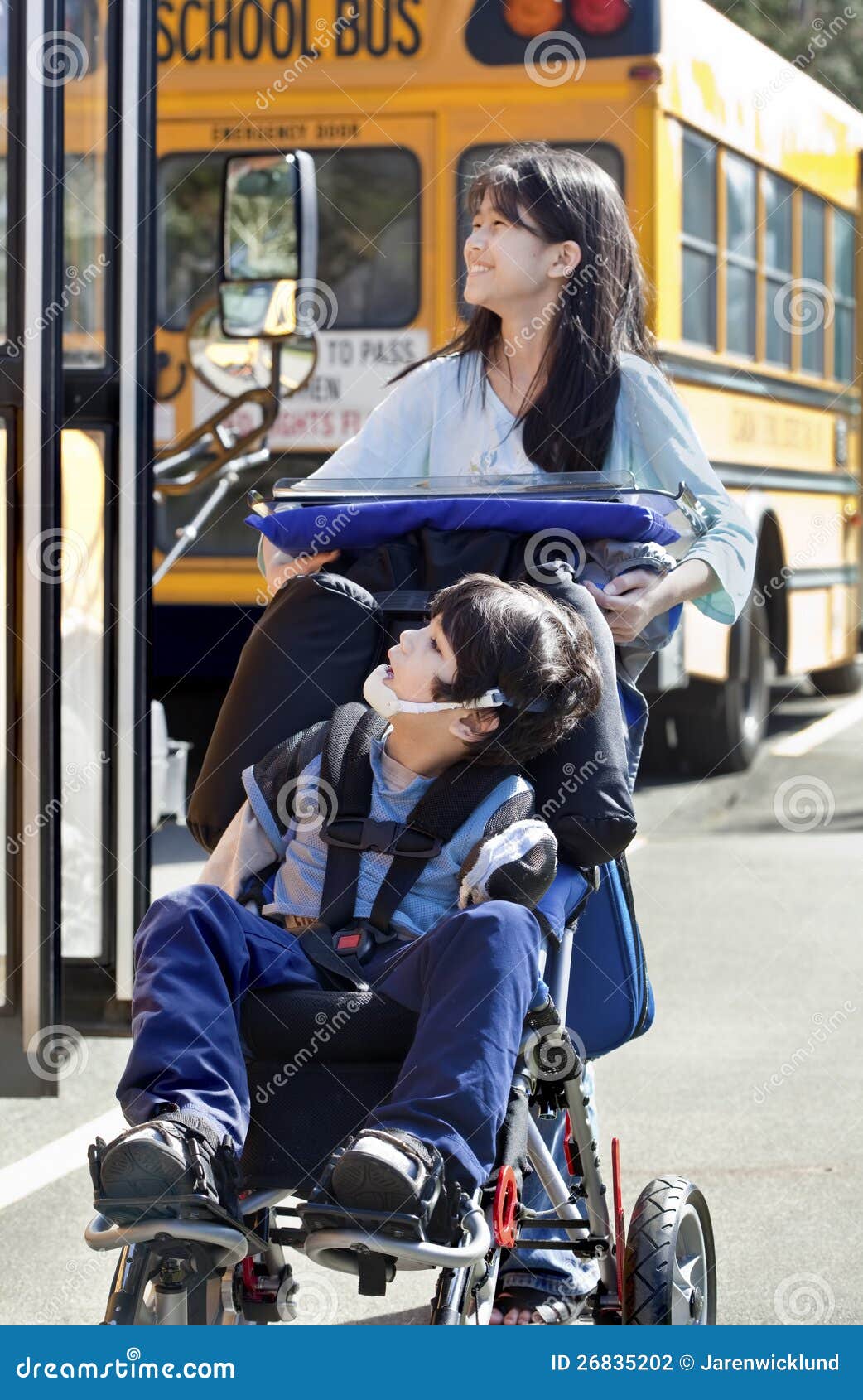 Sister Pushing Disabled Brother in Wheelchair Stock Photo - Image of ...