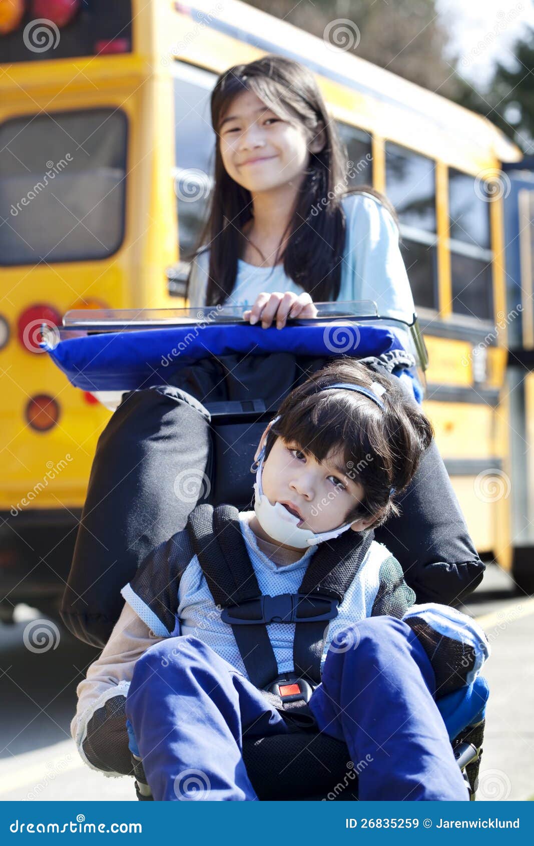 Sister Pushing Disabled Brother in Wheelchair Stock Image - Image of ...
