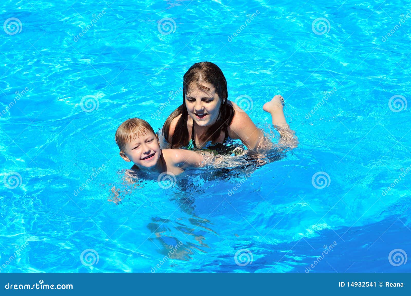 Sister Teaching Brother To Swim Stock Image - Image of smiling, pool ...