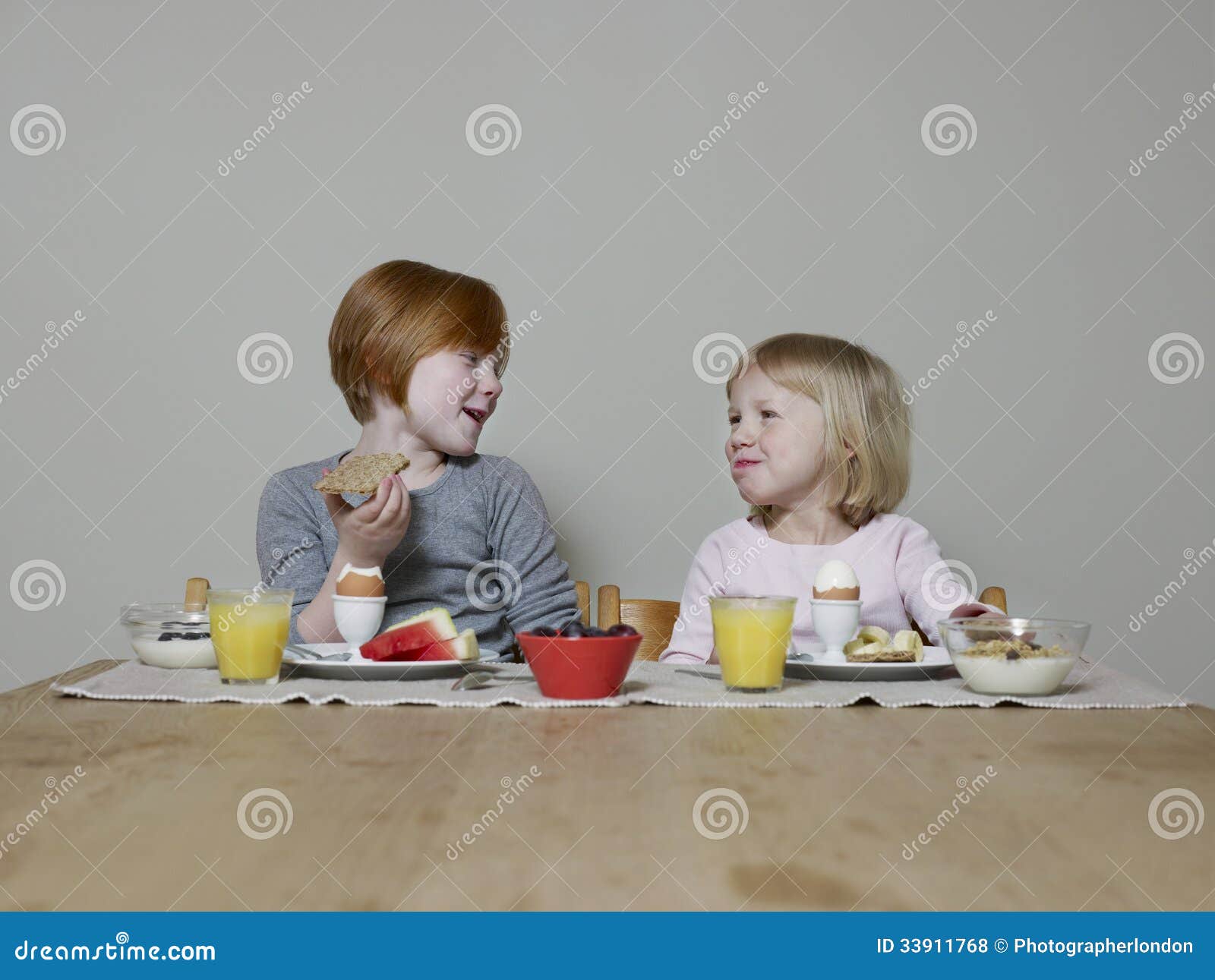 Sisters Chat while Eating Breakfast Stock Photo - Image of girls ...