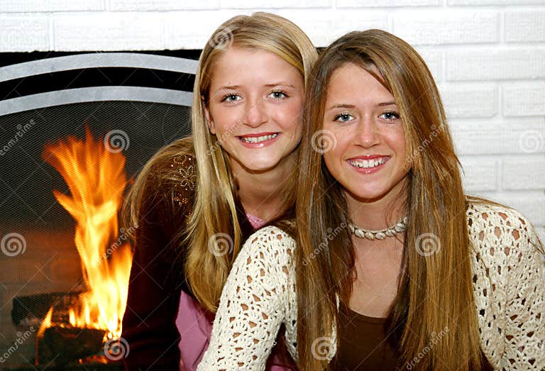 Sisters by the Fireside stock image. Image of home, hearth - 341351