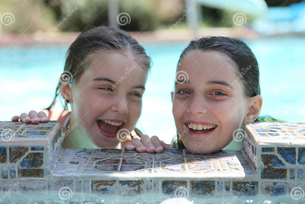 Sisters Having Fun in a Swimming Pool Outdoors Stock Image - Image of ...