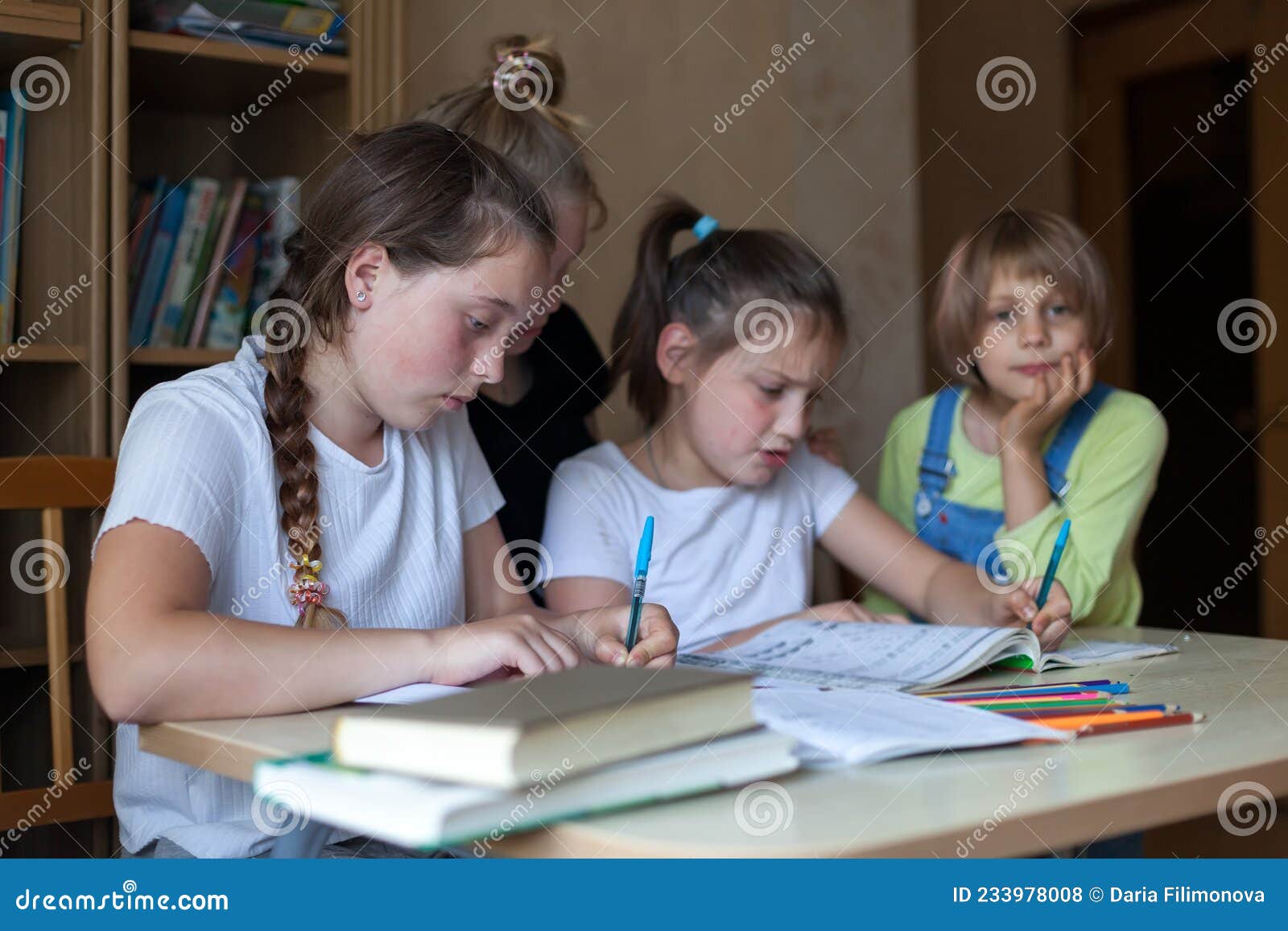 Sisters Learning Lessons at Table Stock Photo - Image of back, distant ...