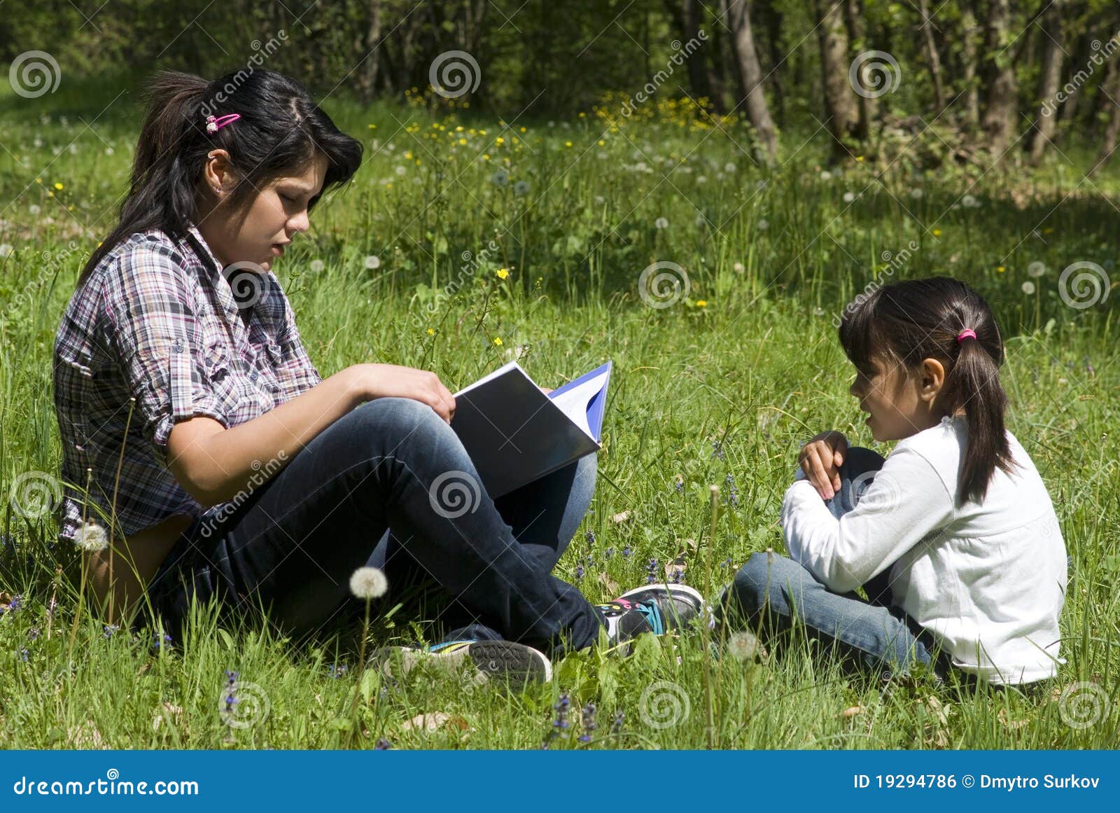 Sisters Reading Book Together Stock Photo - Image of innocent, friends ...