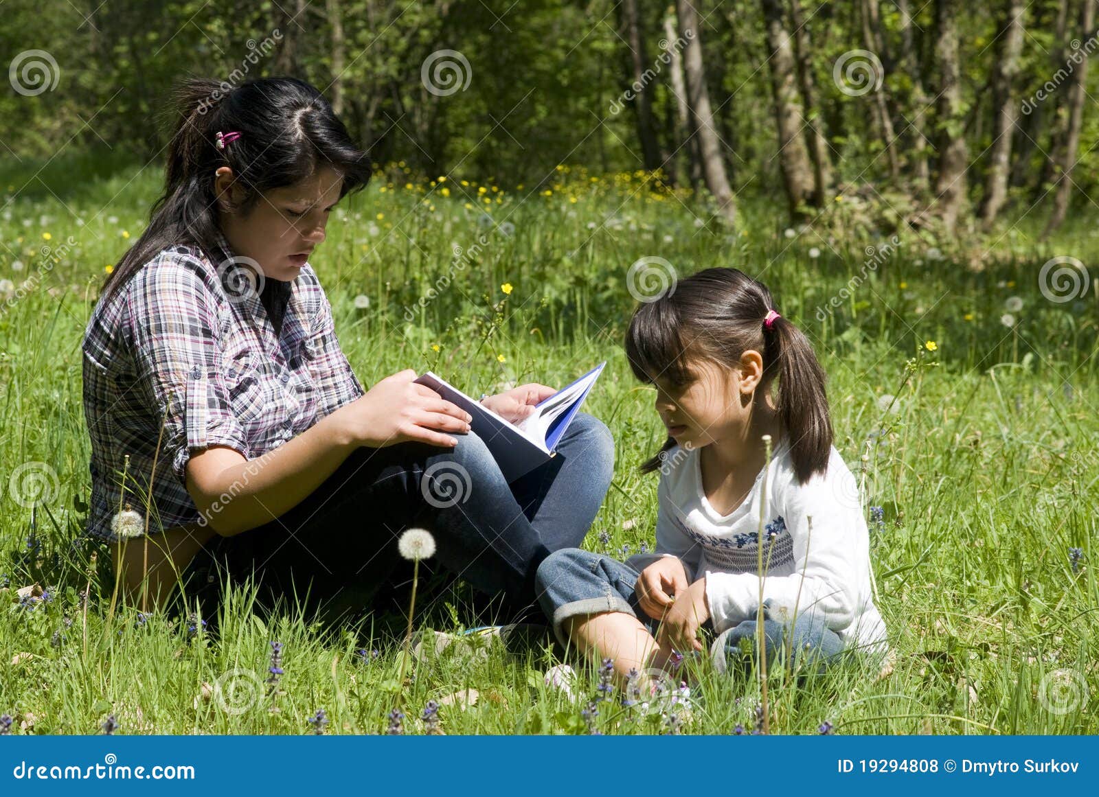 Sisters Reading Book Together Stock Photo - Image of countryside ...