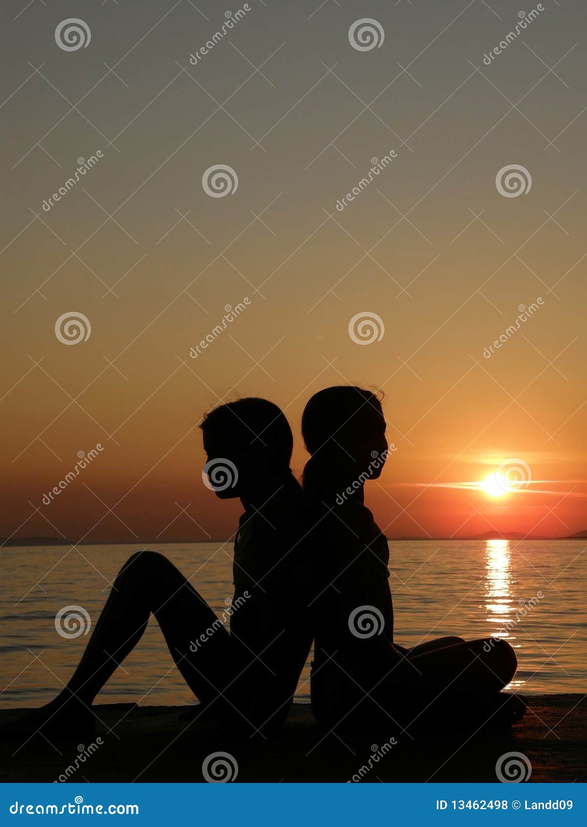 Sisters Sitting Sunset Sea Stock Photos - Free & Royalty-Free Stock ...