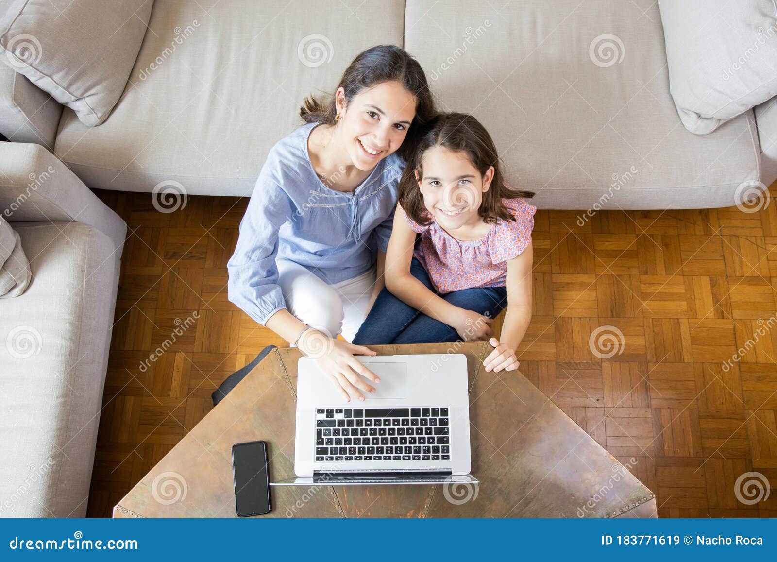 Sisters at Home with Computer Looking at Camera Stock Image - Image of ...