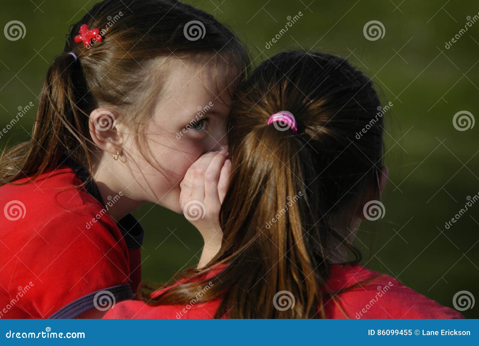 Sisters Telling Secrets To Each Other Whispering in Ears Stock Image ...