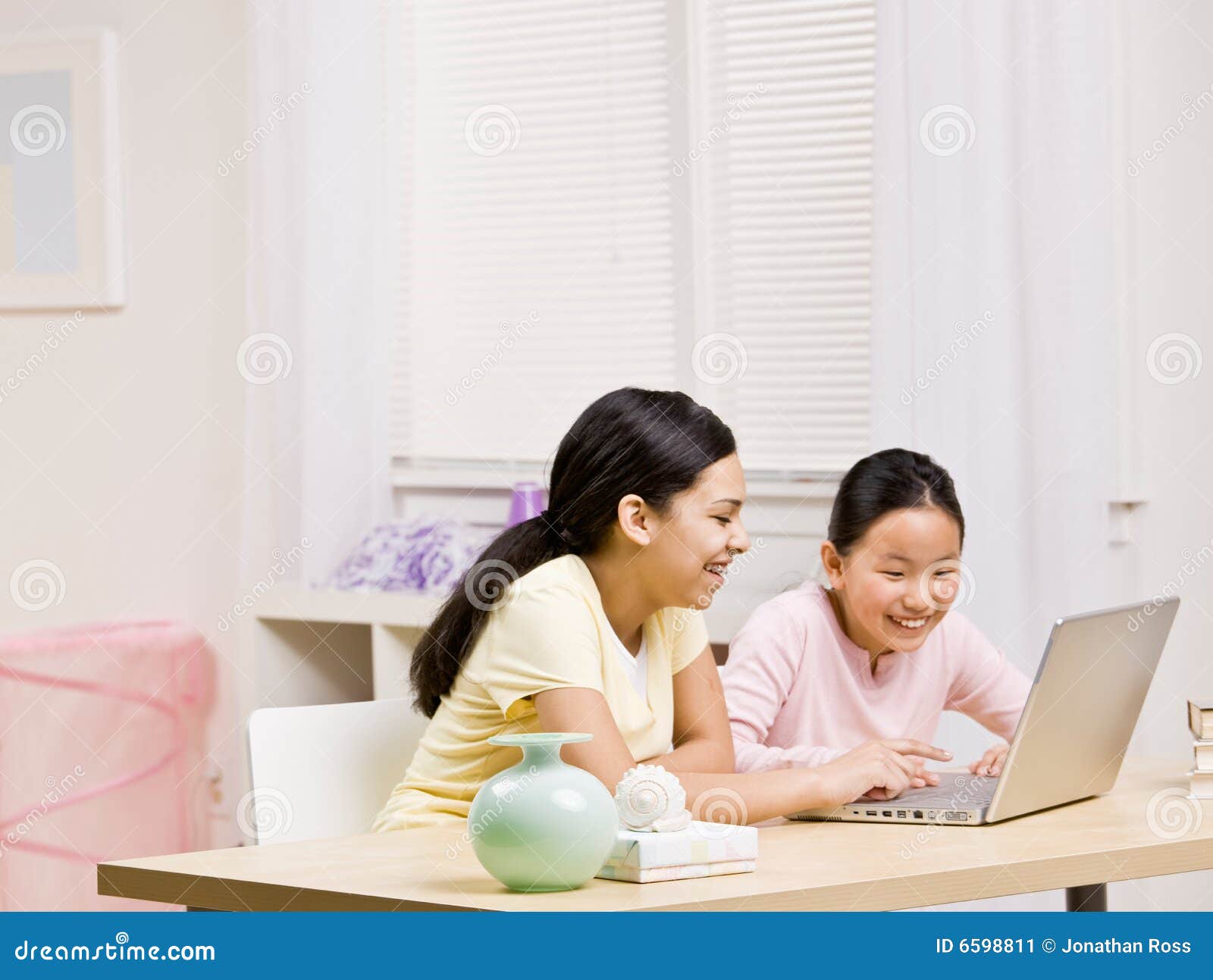 Sisters Use Laptop for Internet Together Stock Image - Image of ...