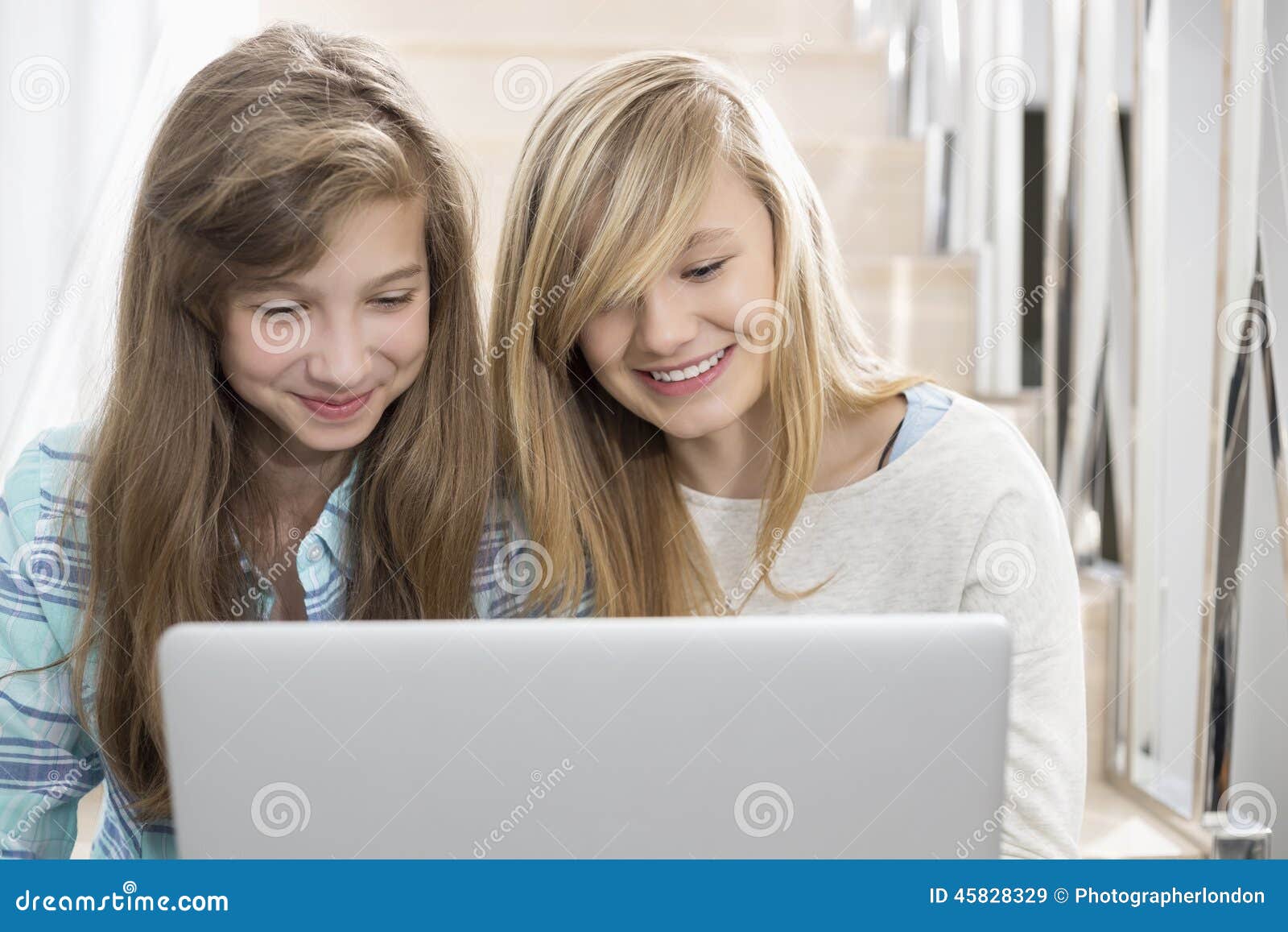 Sisters Using Laptop on Stairway Stock Image - Image of connection ...