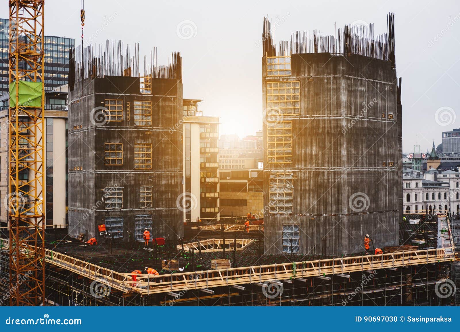 Site Construction in the City with Workers Working in Sunrise Stock ...