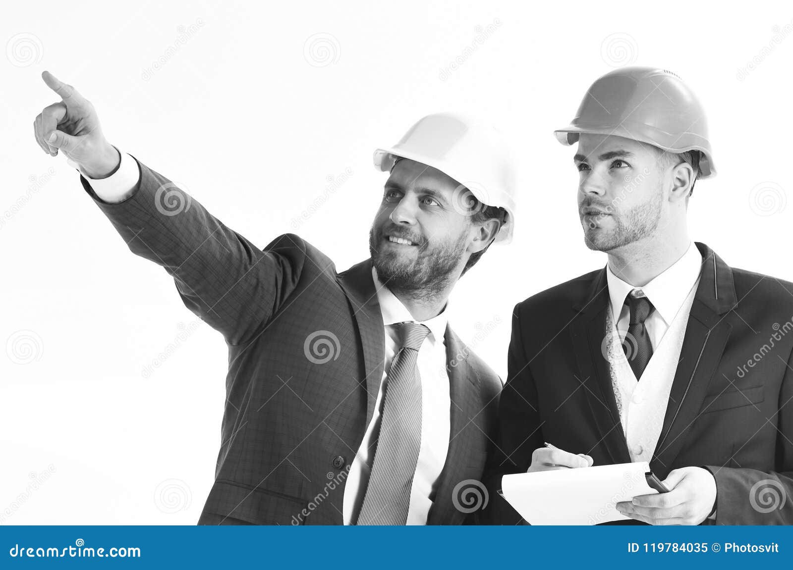 Site and Construction Managers in Helmets. Project Management, Building ...